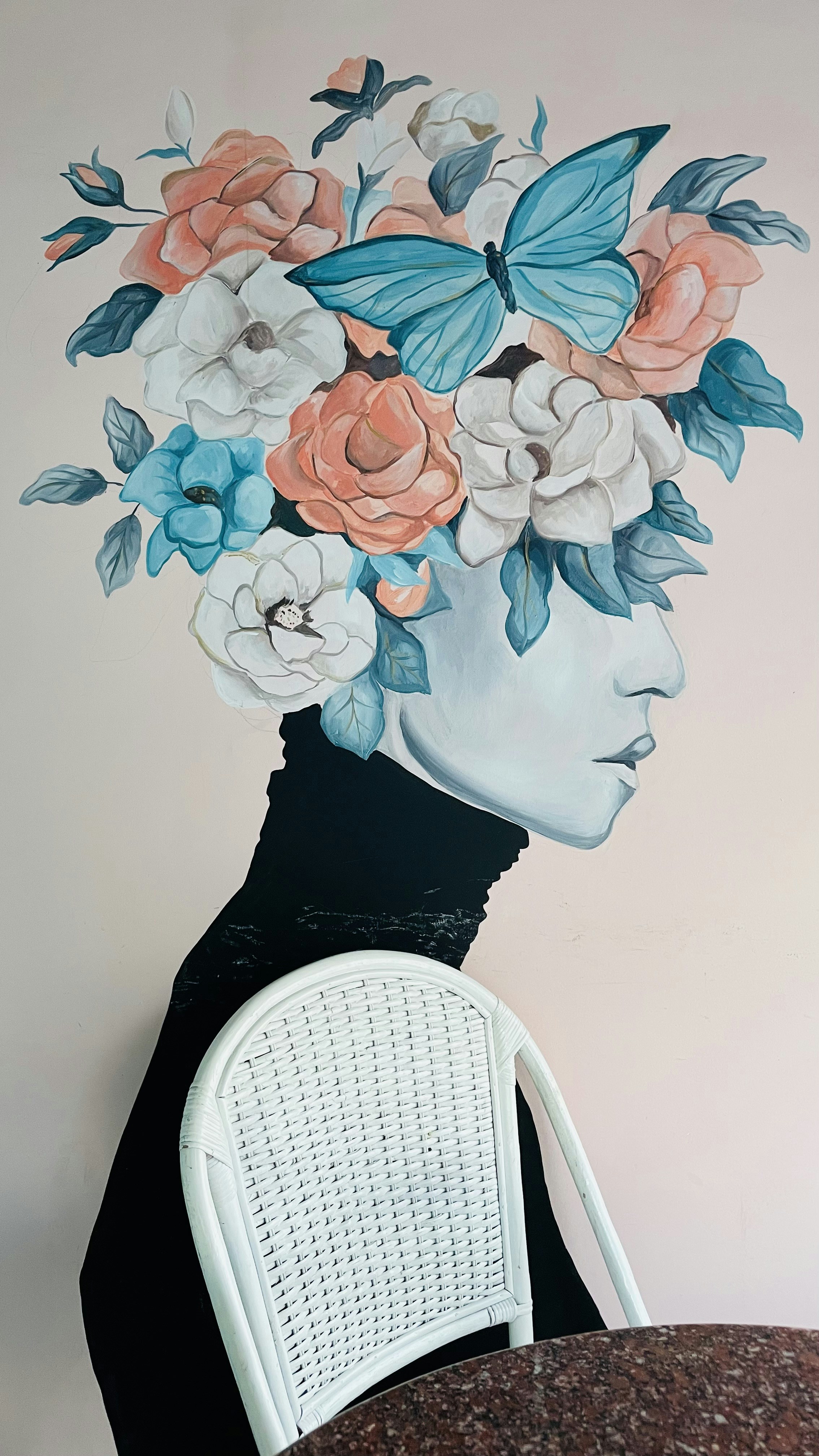 Bloom Crown: A Blue Butterfly Adorns a Silhouette Portrait