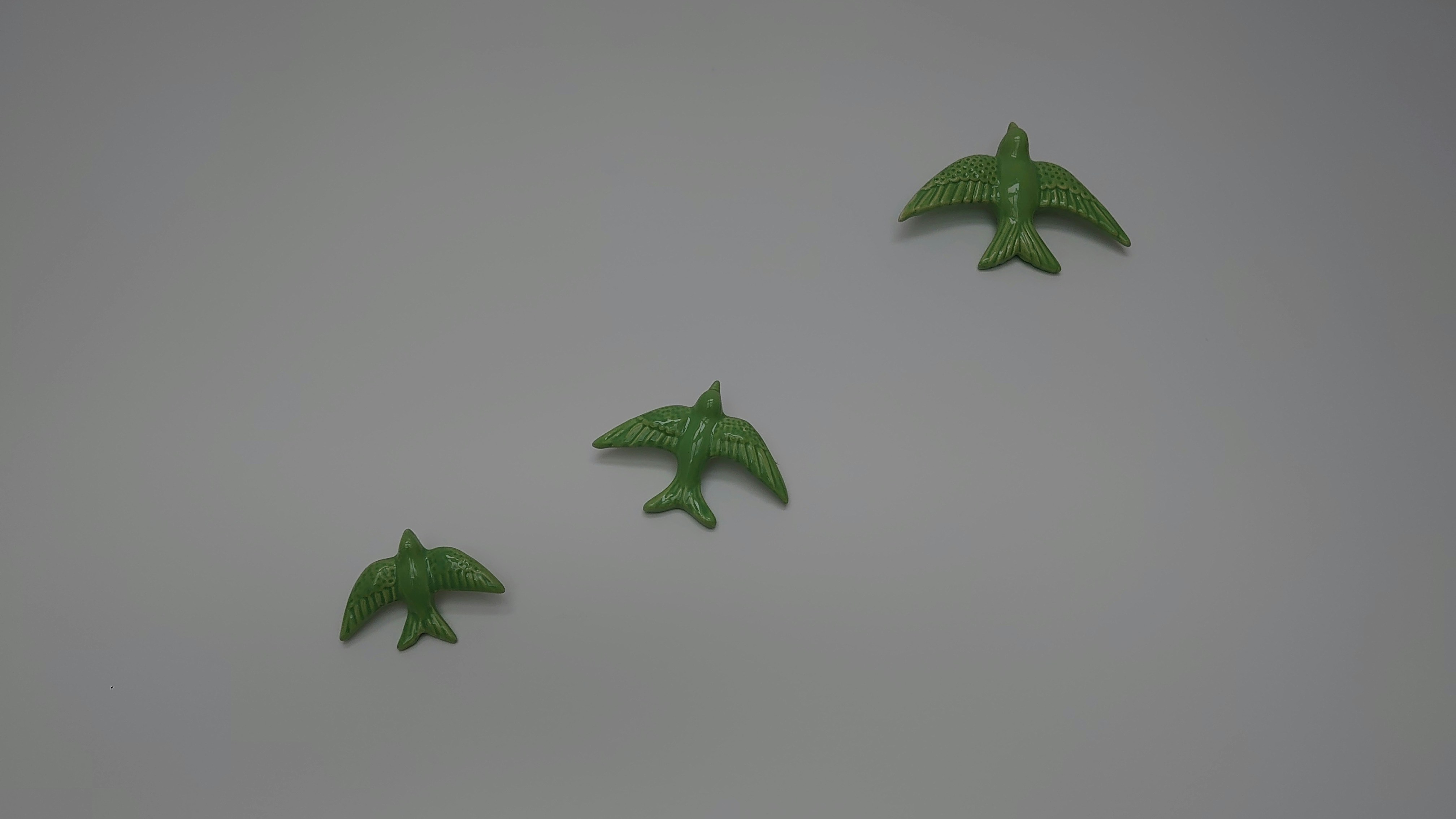 Emerald Triad on a Neutral Grey Stage