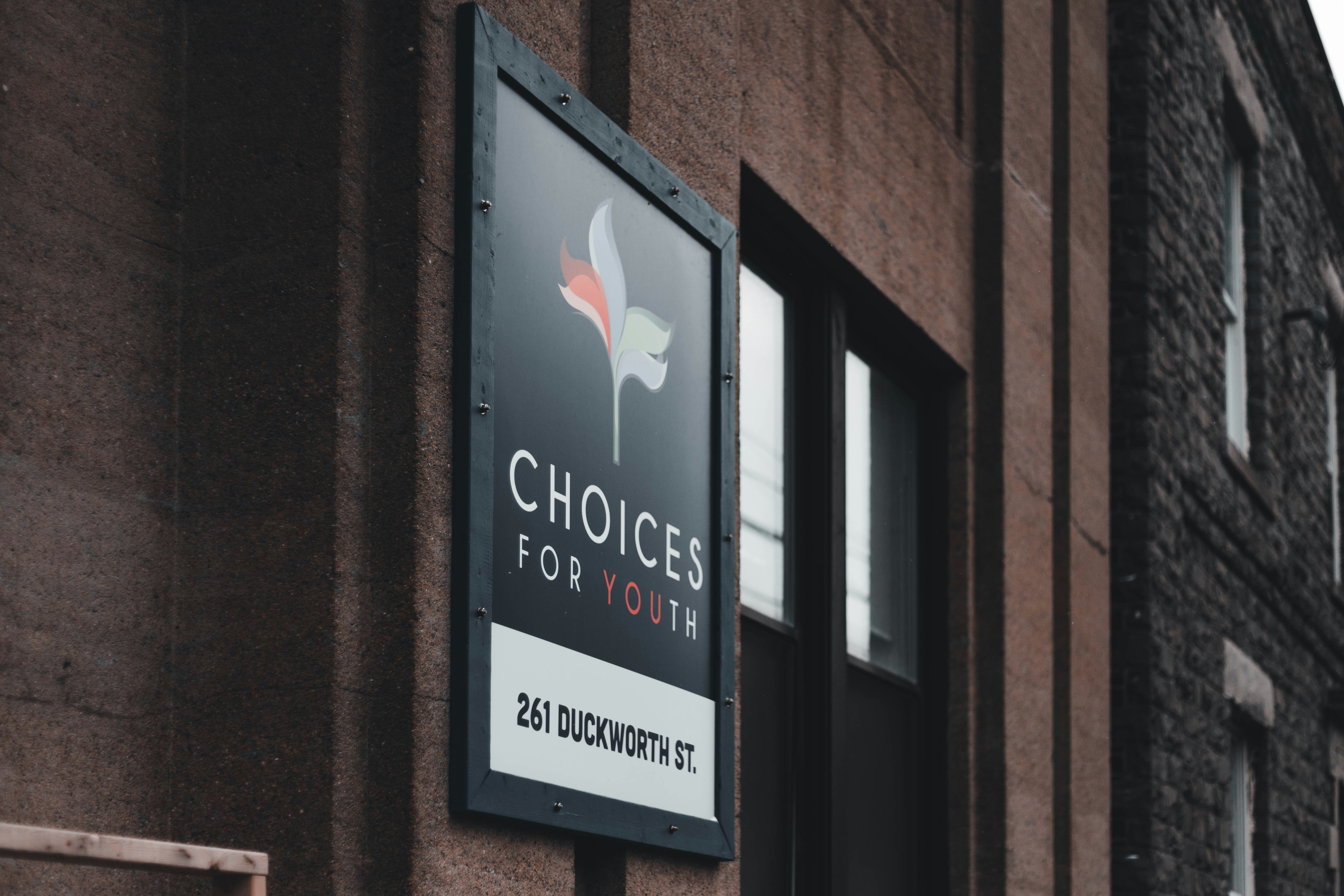 A sign on the side of a building that says choices for youth photo ...