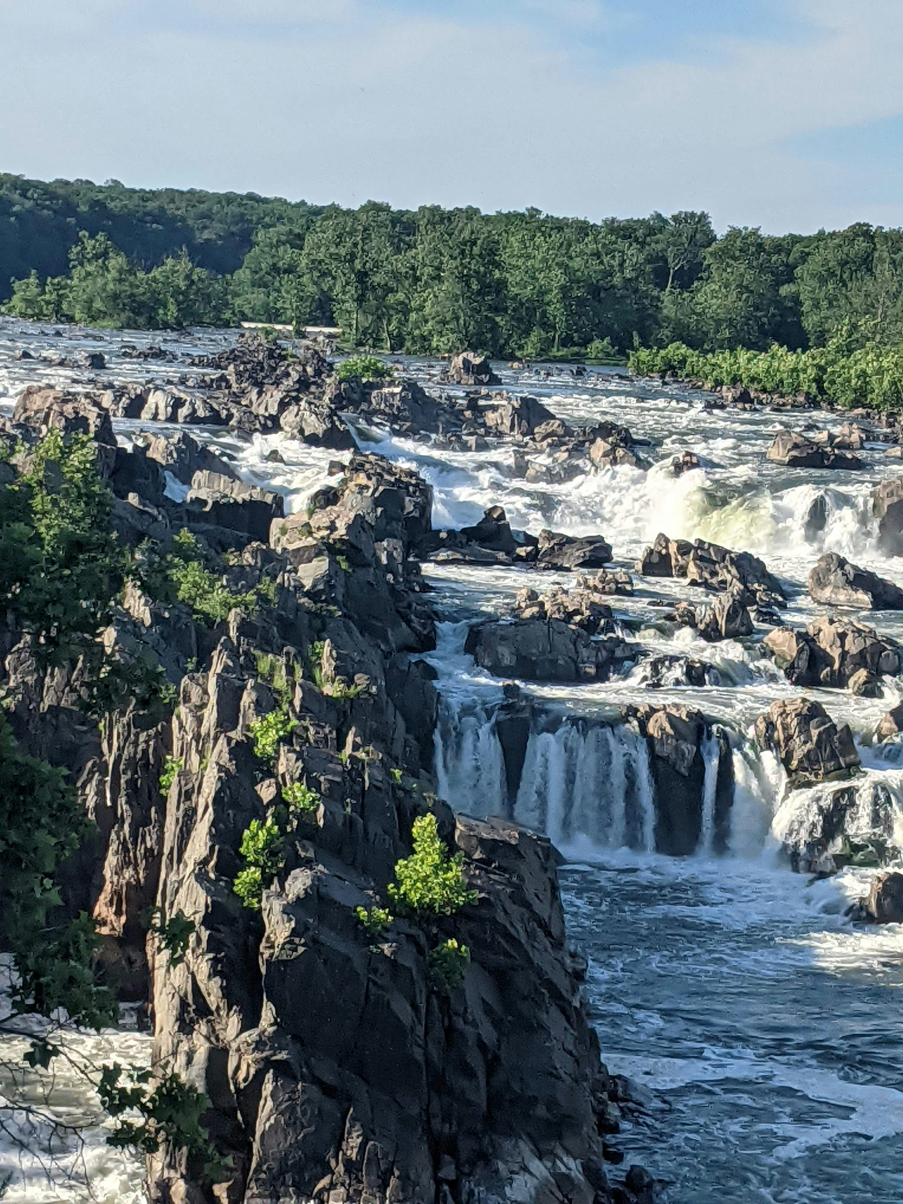 a man riding a horse on top of a river