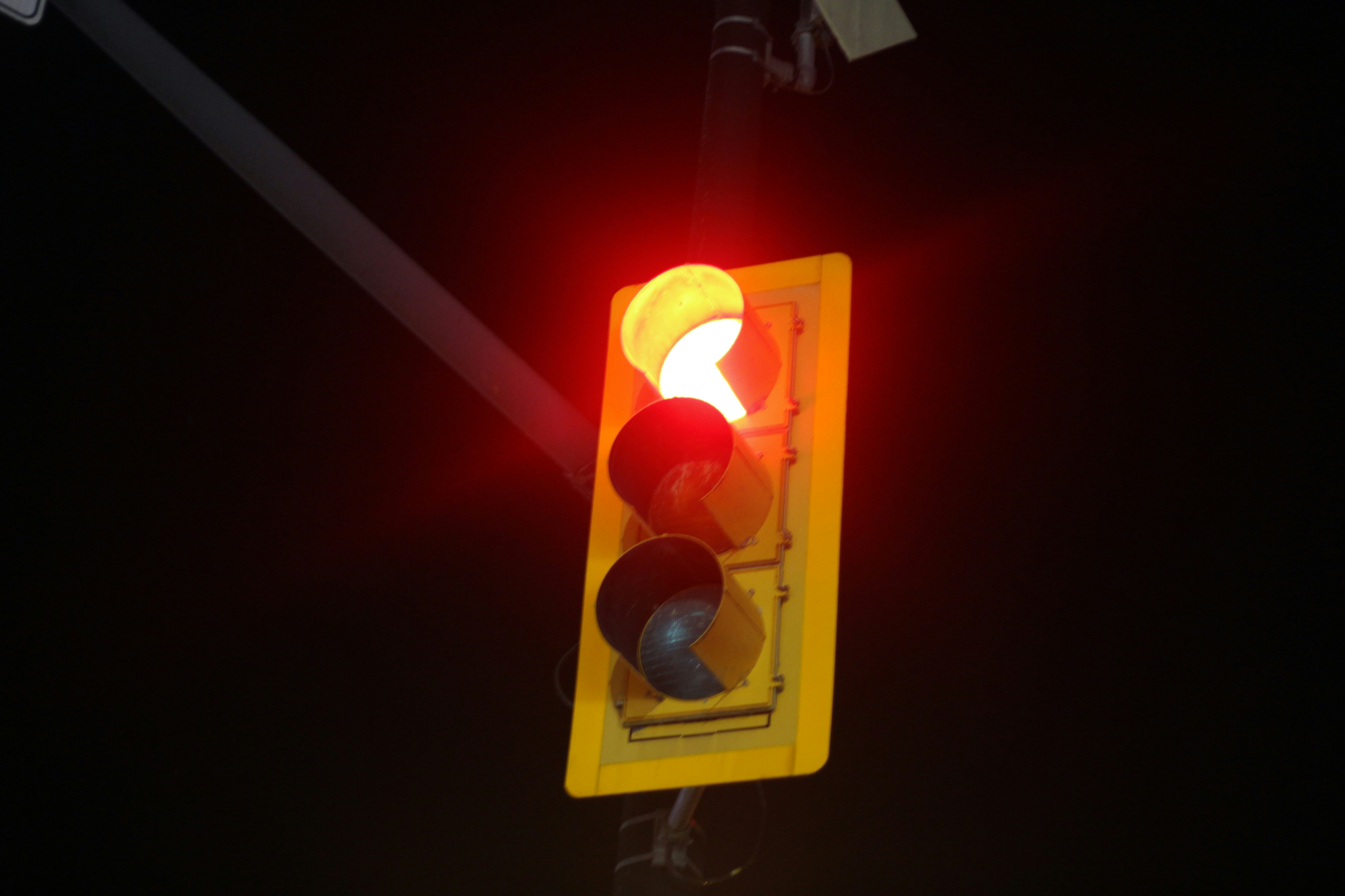 A traffic light with a red light in the dark photo – Free Light Image ...