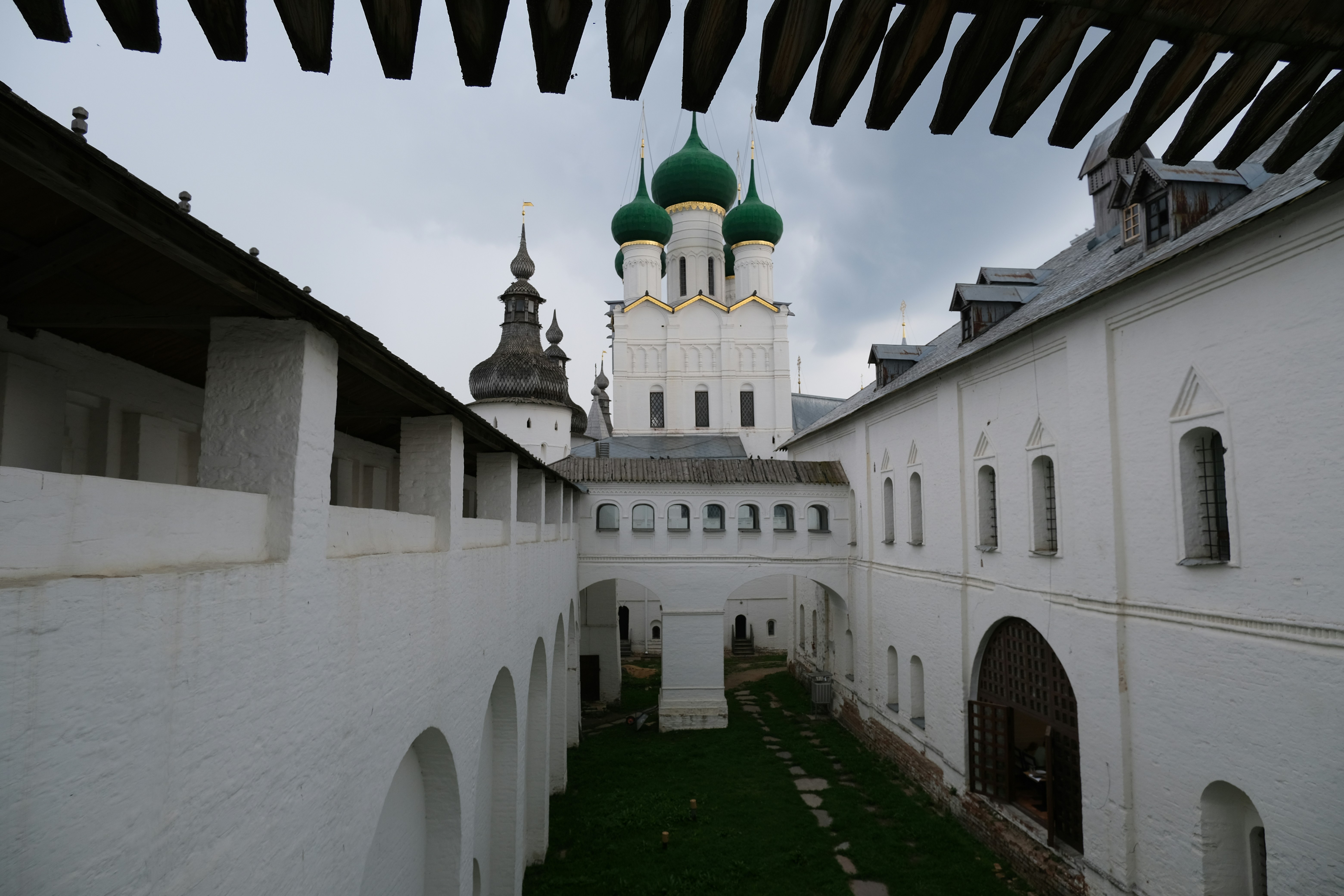 Emerald Domes Above White Cloisters: A Monastic Courtyard Portrait