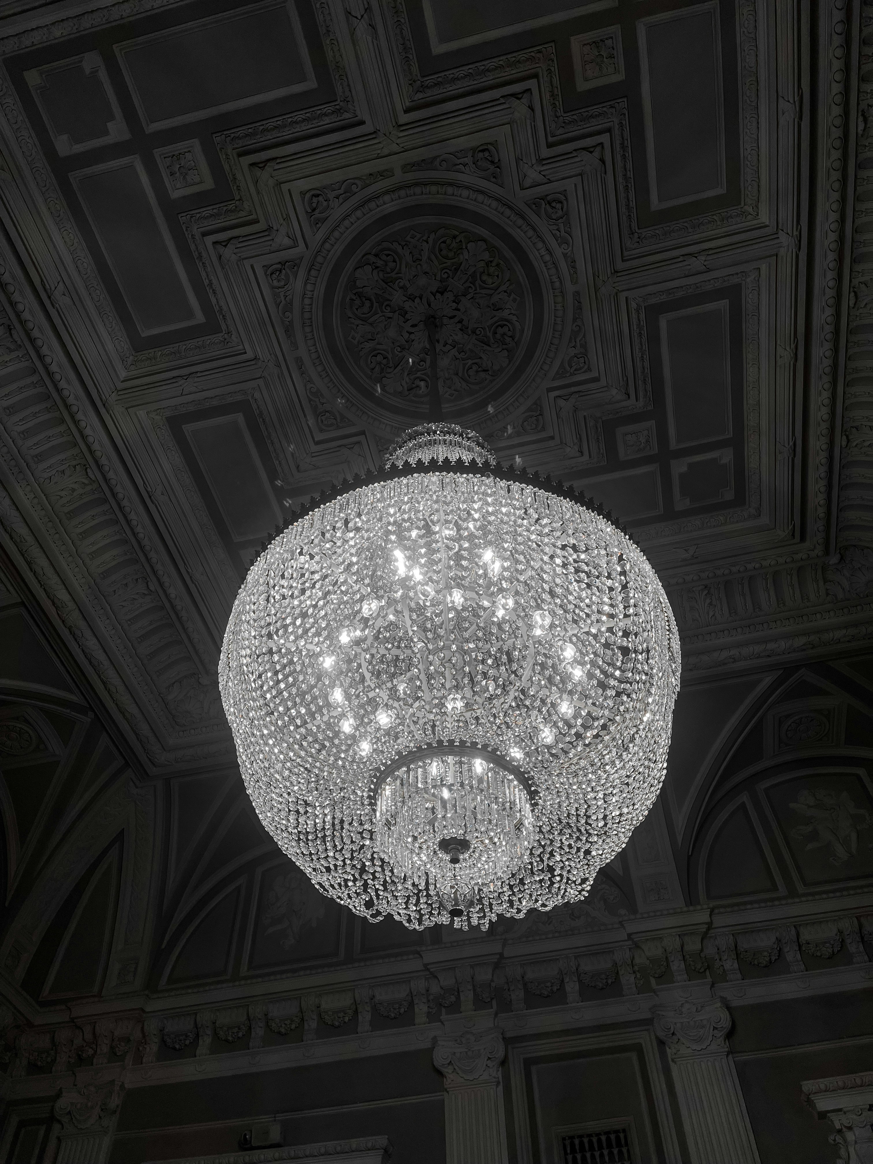 Gilded Luminescence: Crystal Chandelier in a Neoclassical Hall
