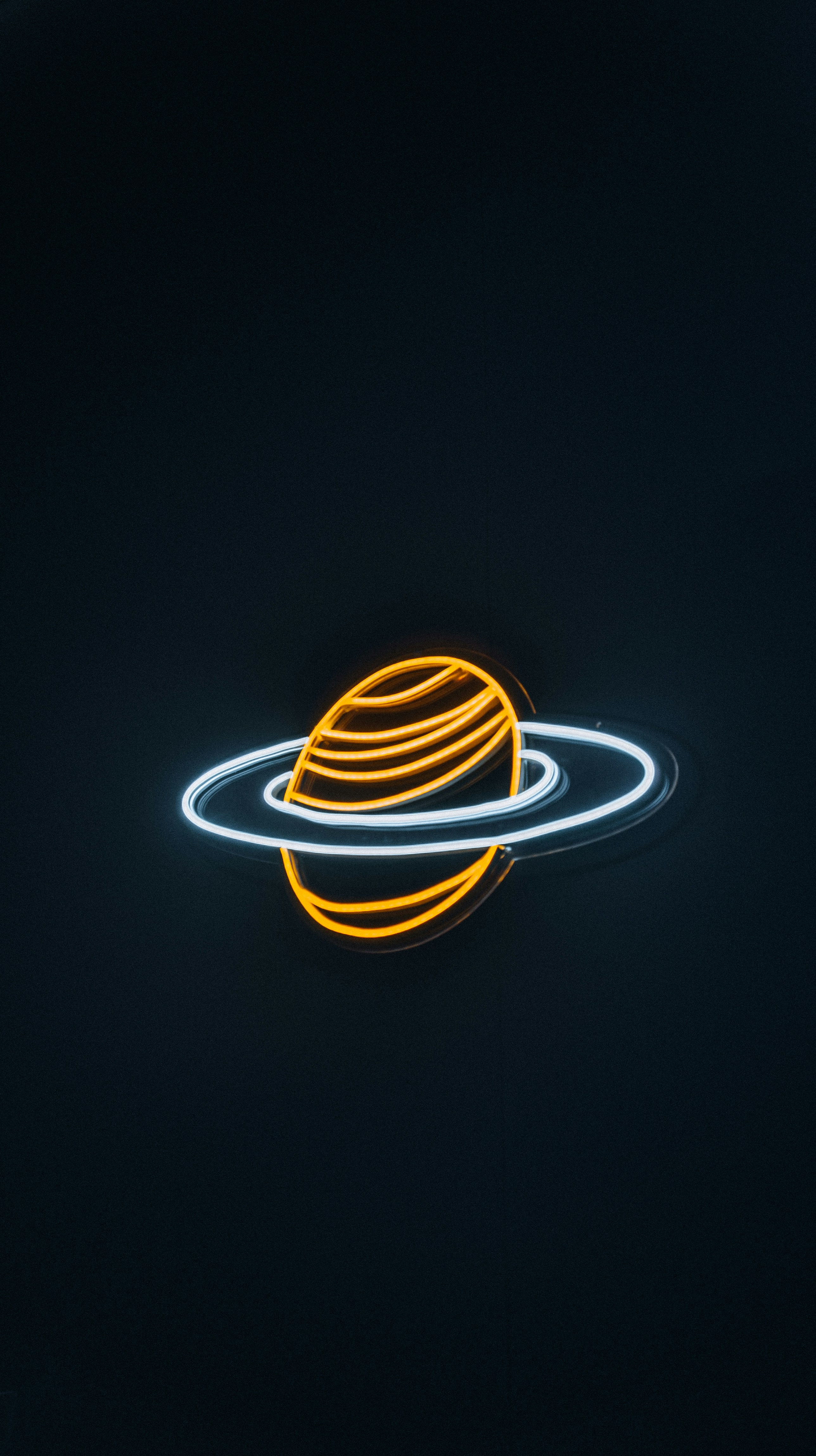 Neon illustration of Saturn, featuring vibrant orange and white rings against a dark background.