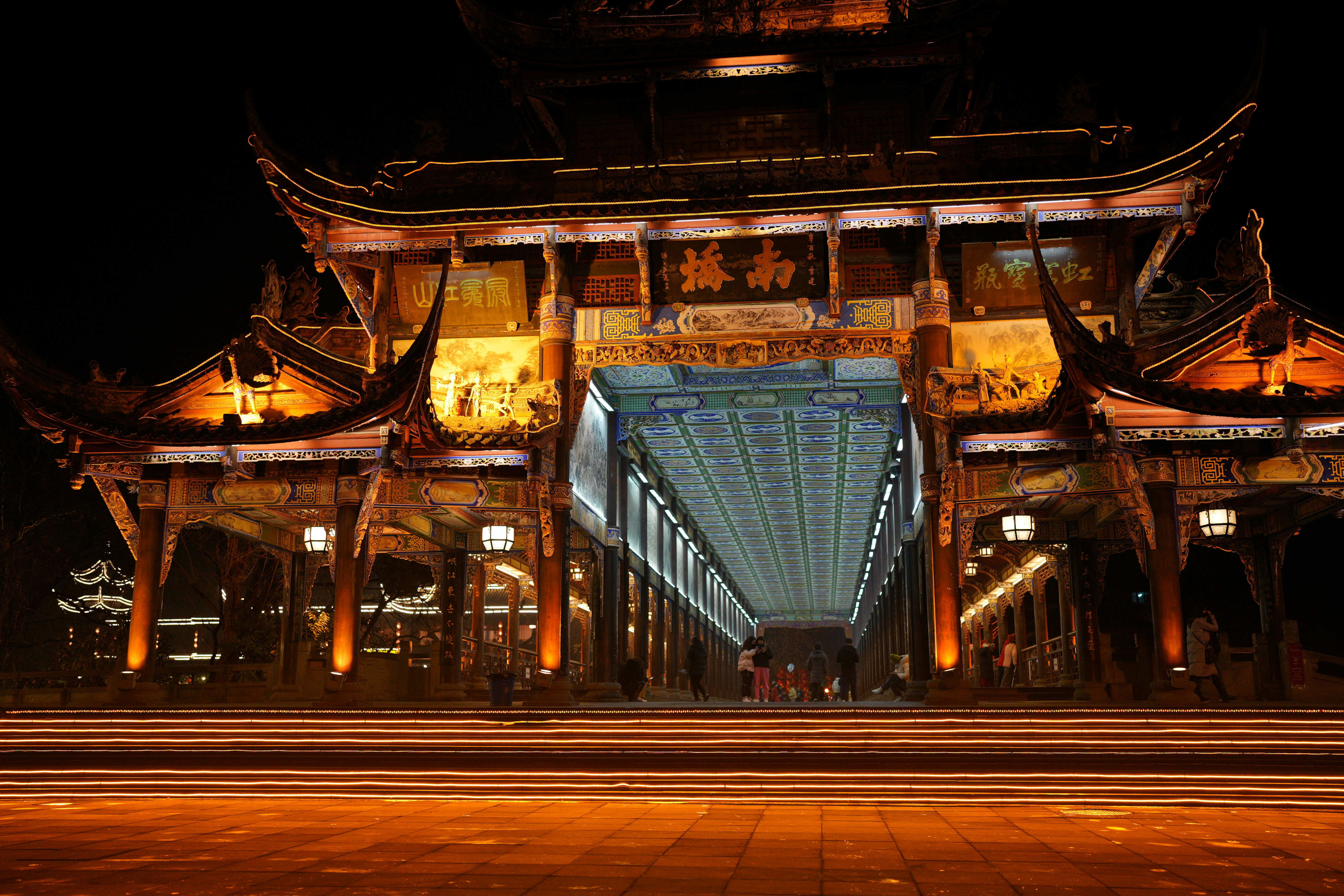 A large building lit up with lights at night photo – Free Dujiangyan ...