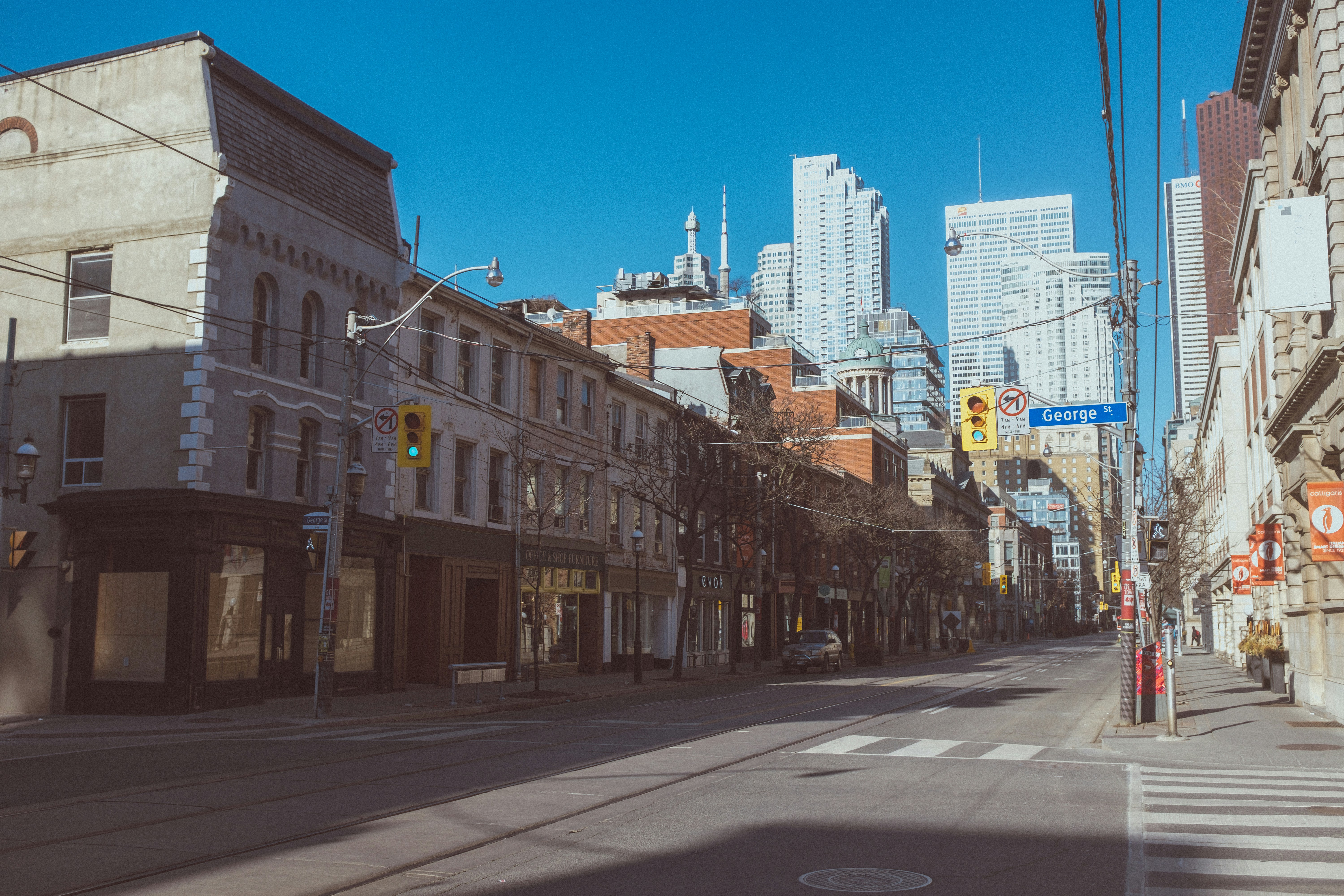 A city street with buildings on both sides photo – Free Toronto Image ...