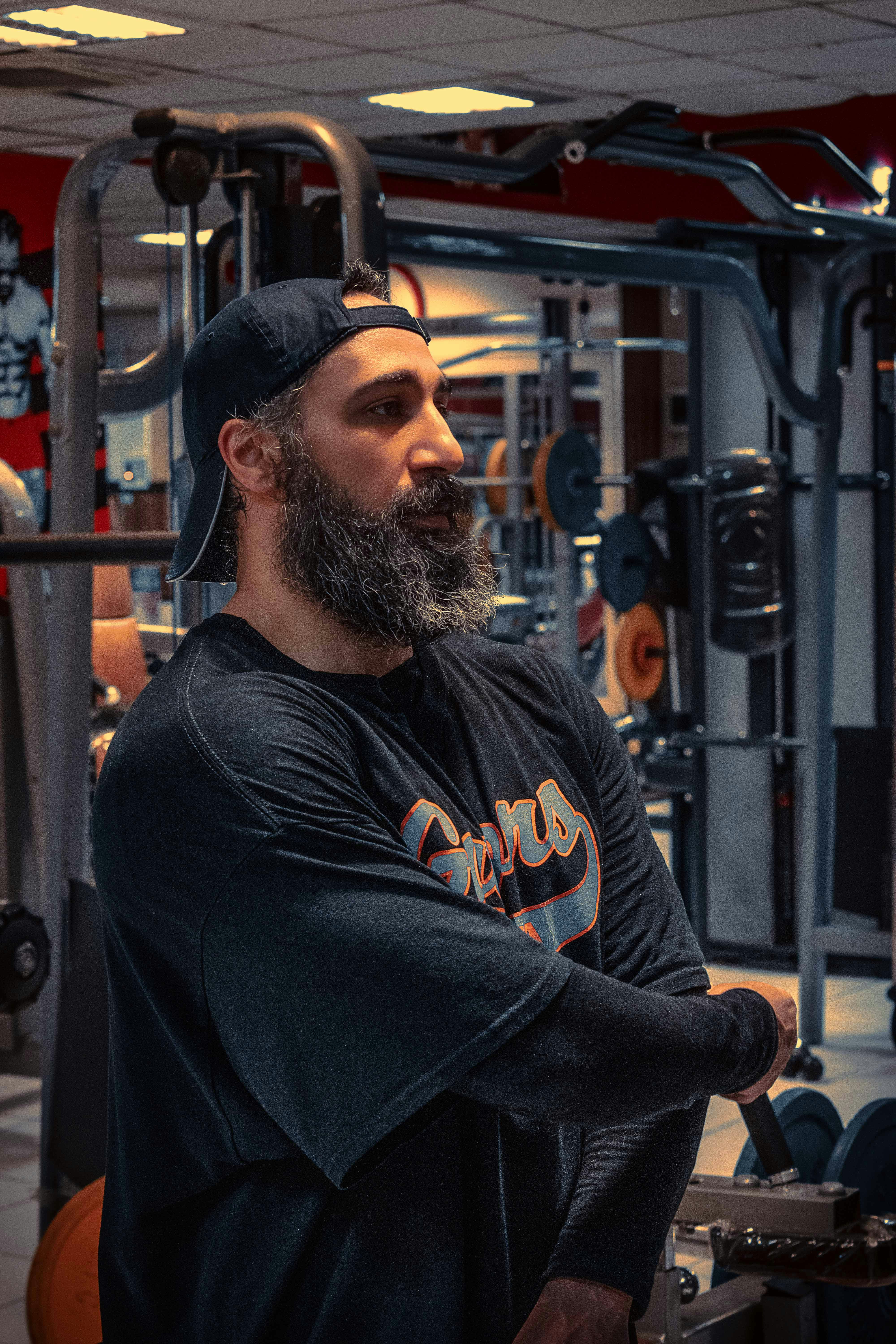 A man with a beard standing in a gym photo – Free Fitness Image on Unsplash