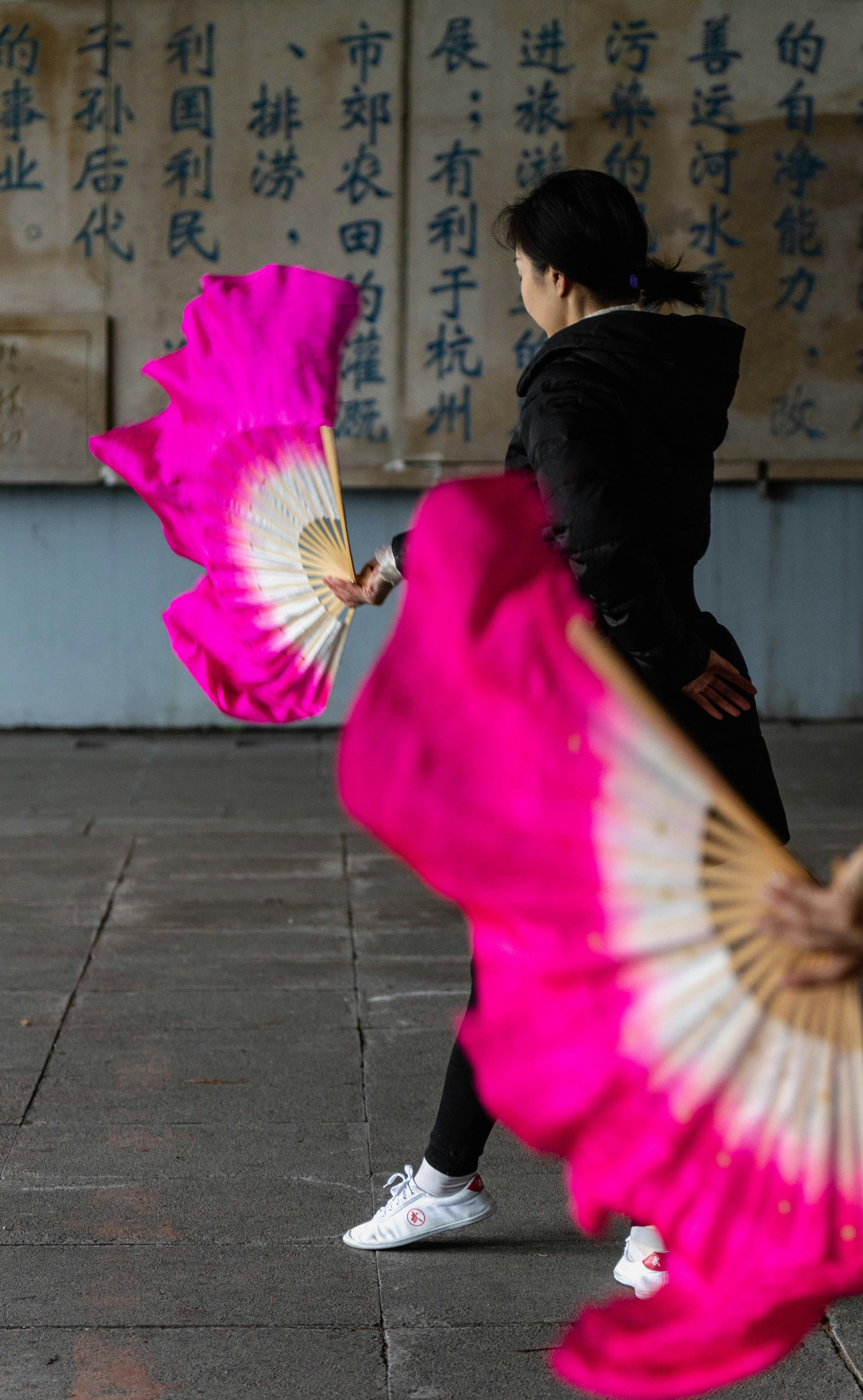 Vivid Fan Dance Amid Ancient Script