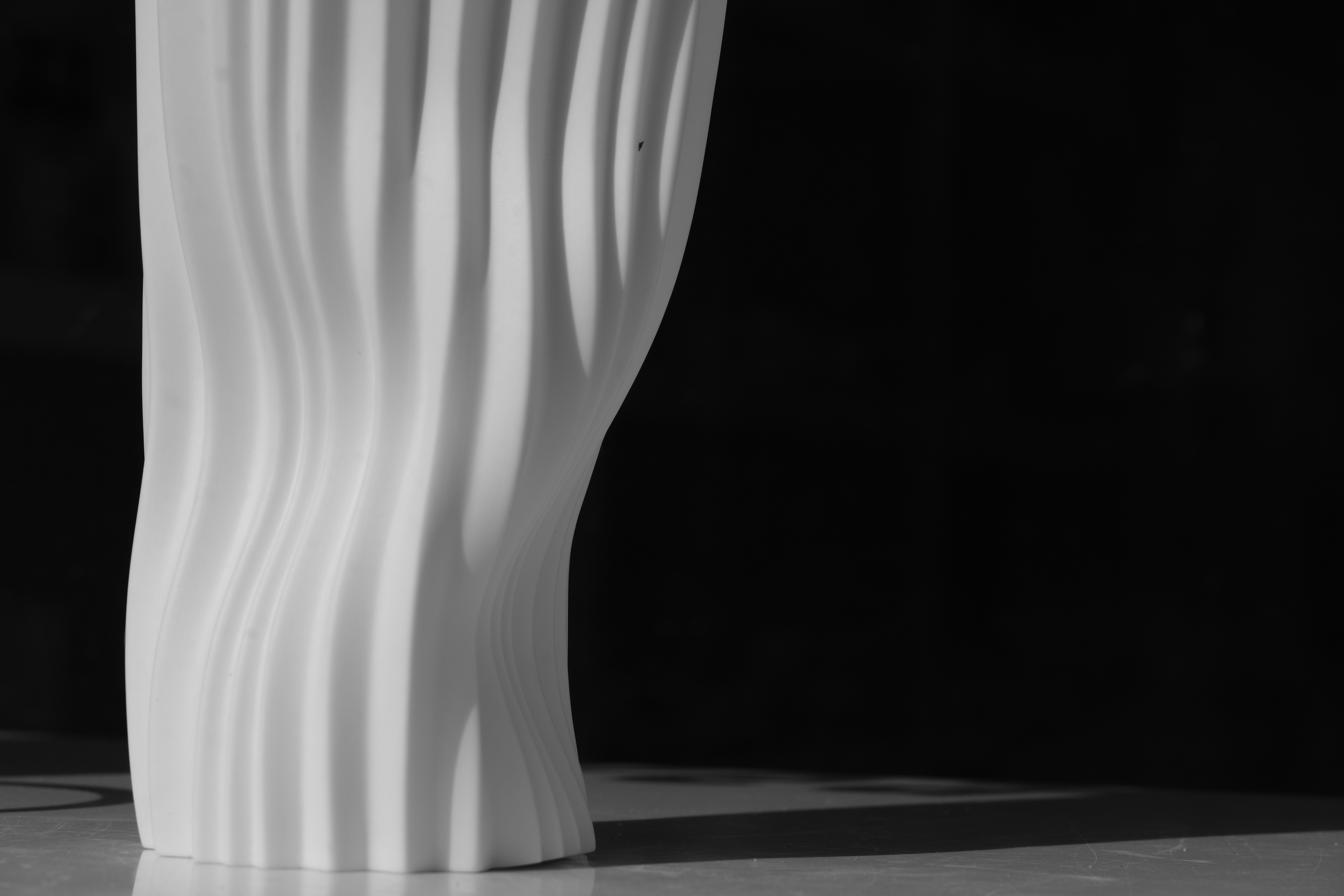 Grooved Vessel in Shadow: A Study of White Form