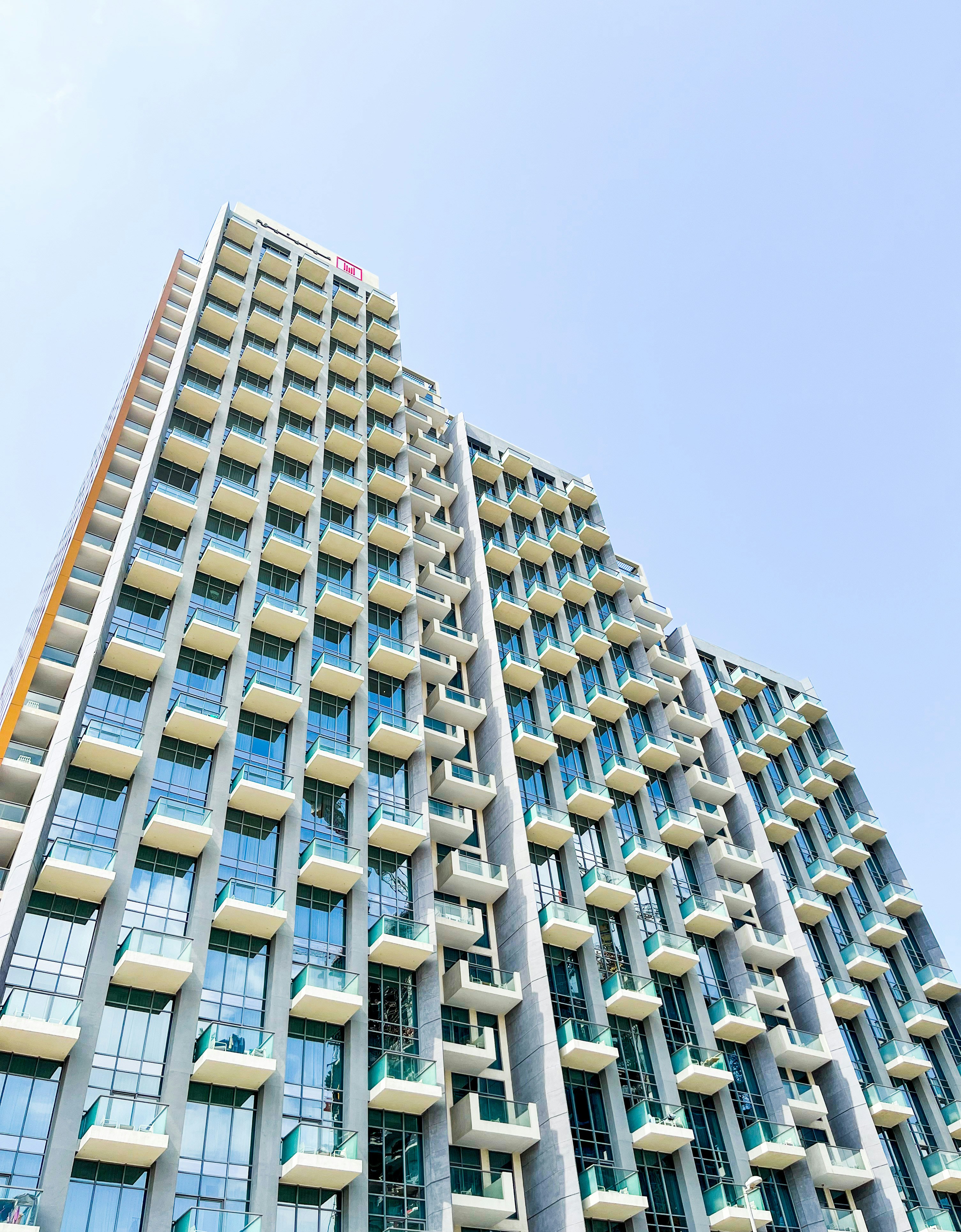 A tall building with balconies and balconies on it photo – Free United ...