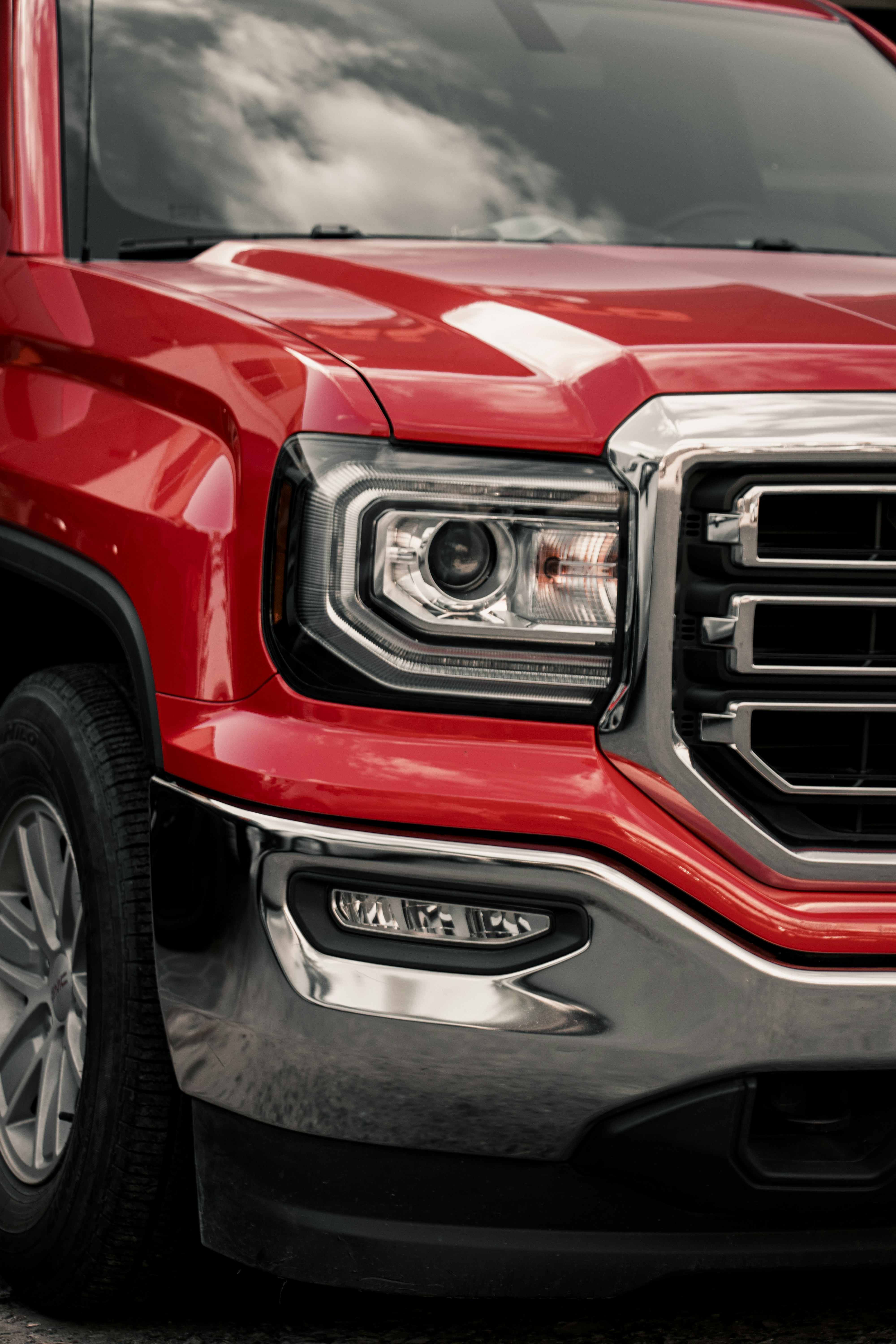 Scarlet Grille: Close-Up on Chrome Armor of a Heavy-Duty Truck