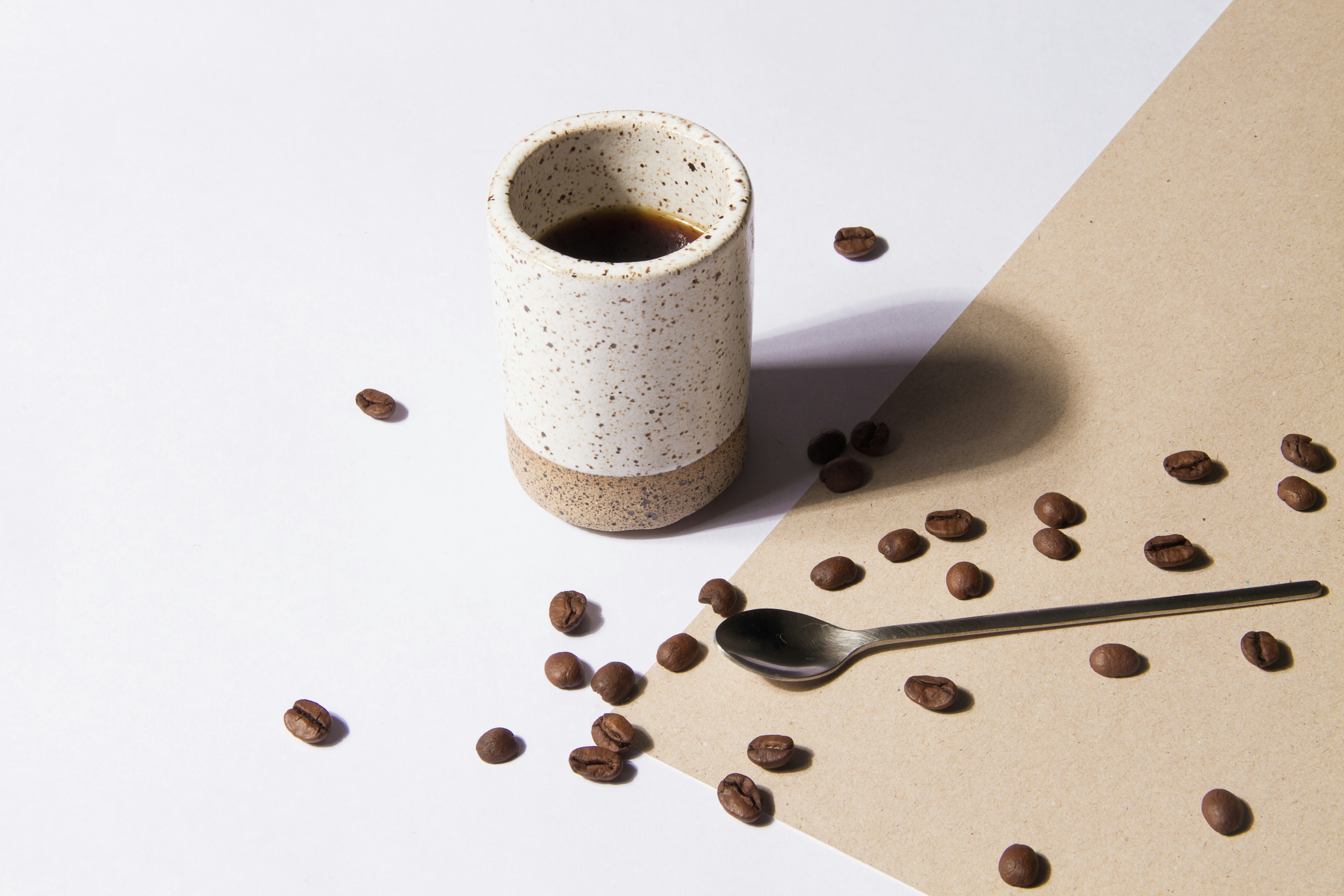 Speckled Cup on a Split-Plane Table: Quiet Coffee Moment