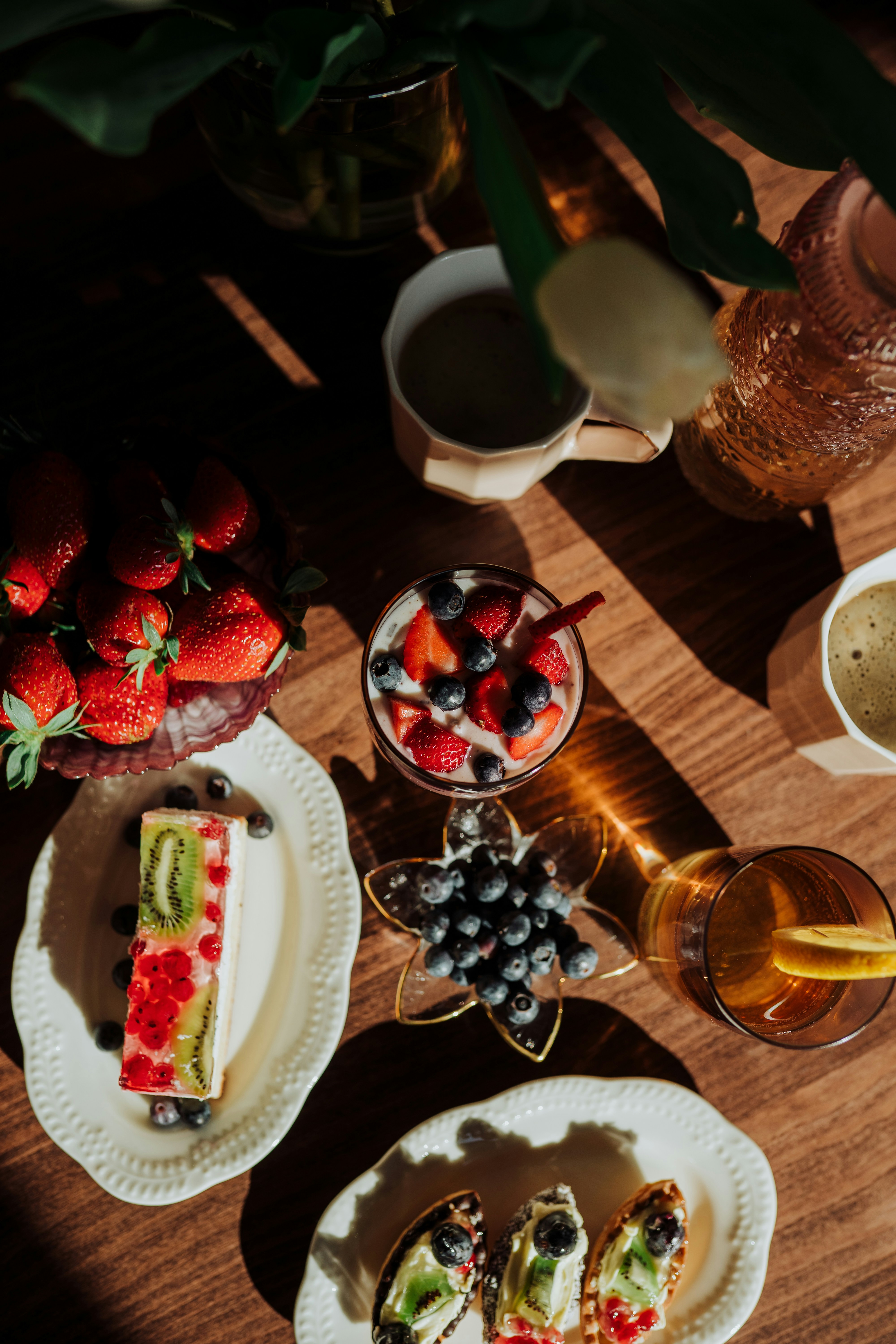 Sun-Dappled Berry Table: A Quiet Spread of Fruit, Pastry, and Glassware