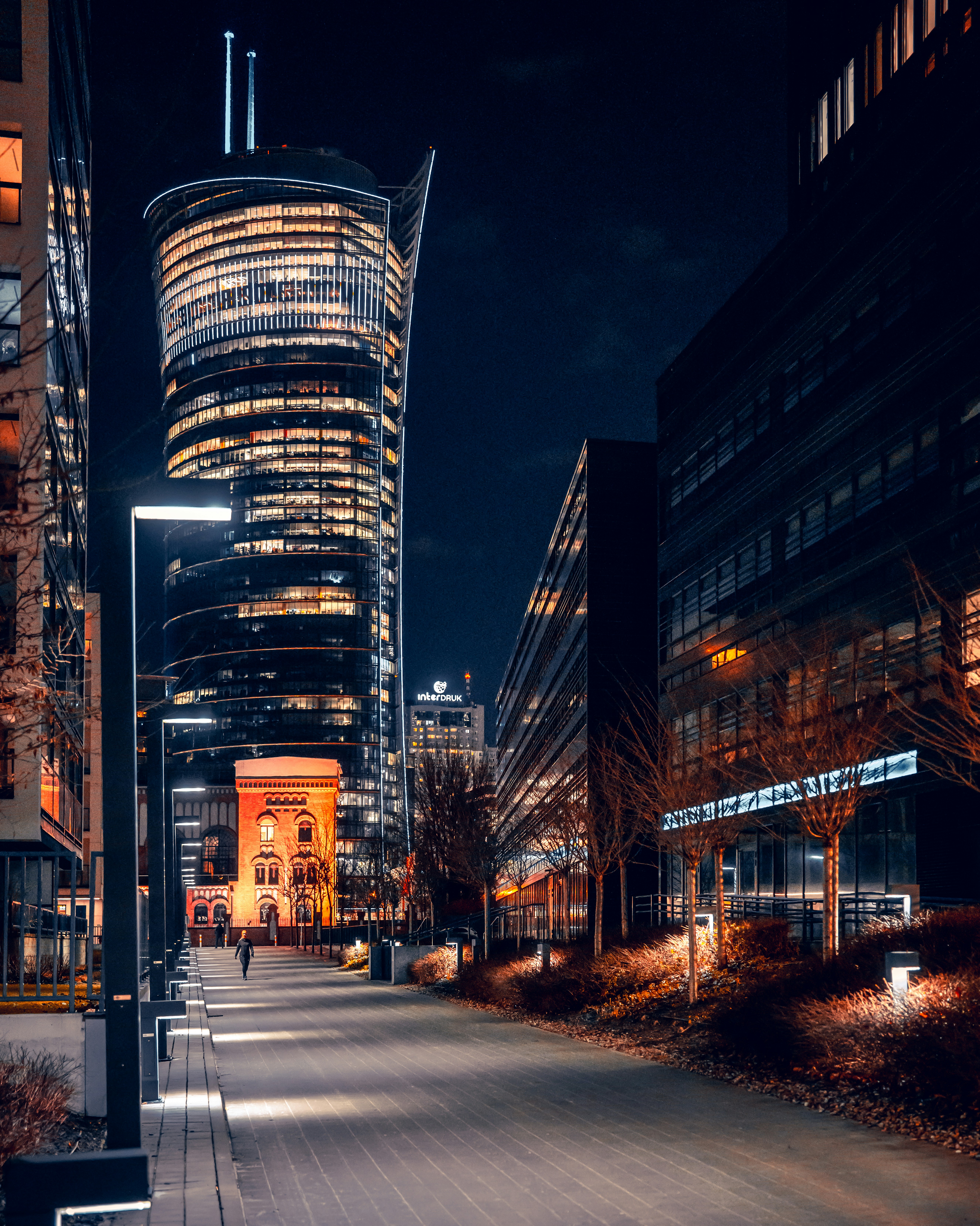 Night Walk Toward the Glass Cylinder Tower