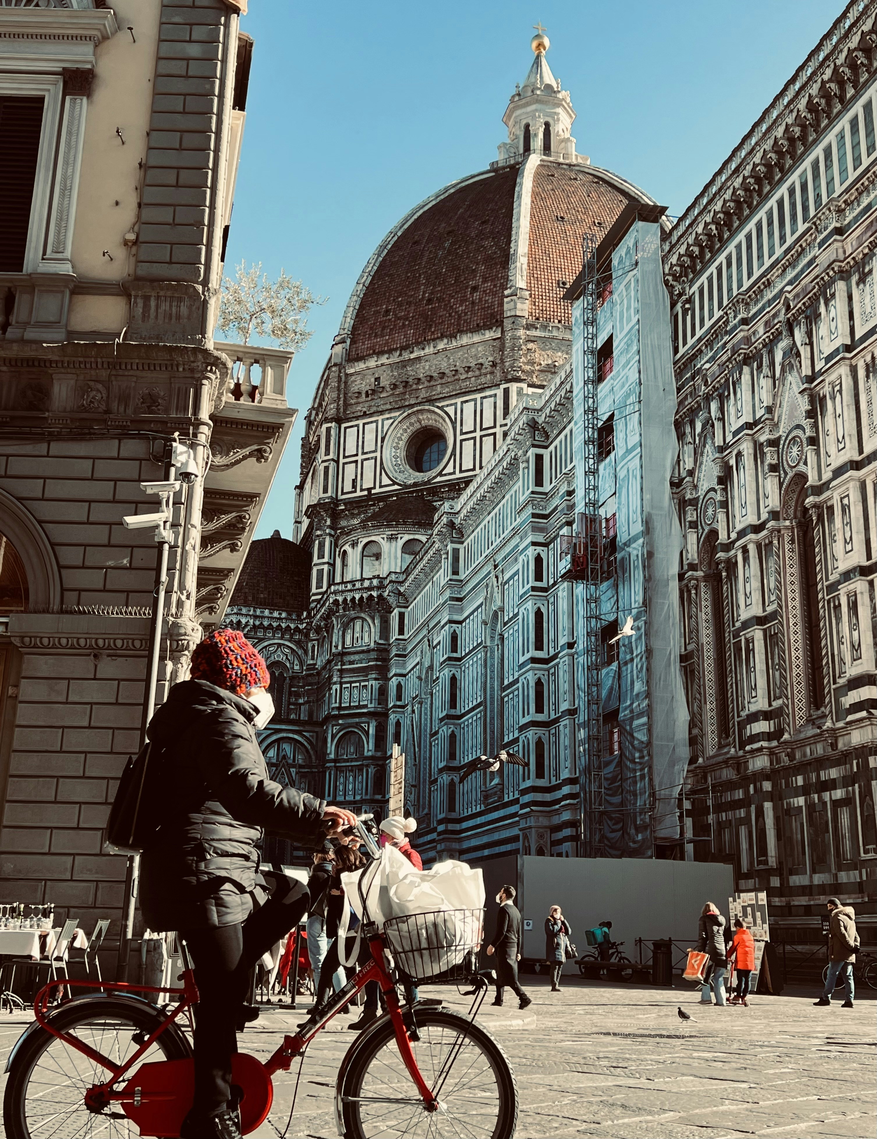 Bicycle Courier in the Shadow of Florence's Duomo