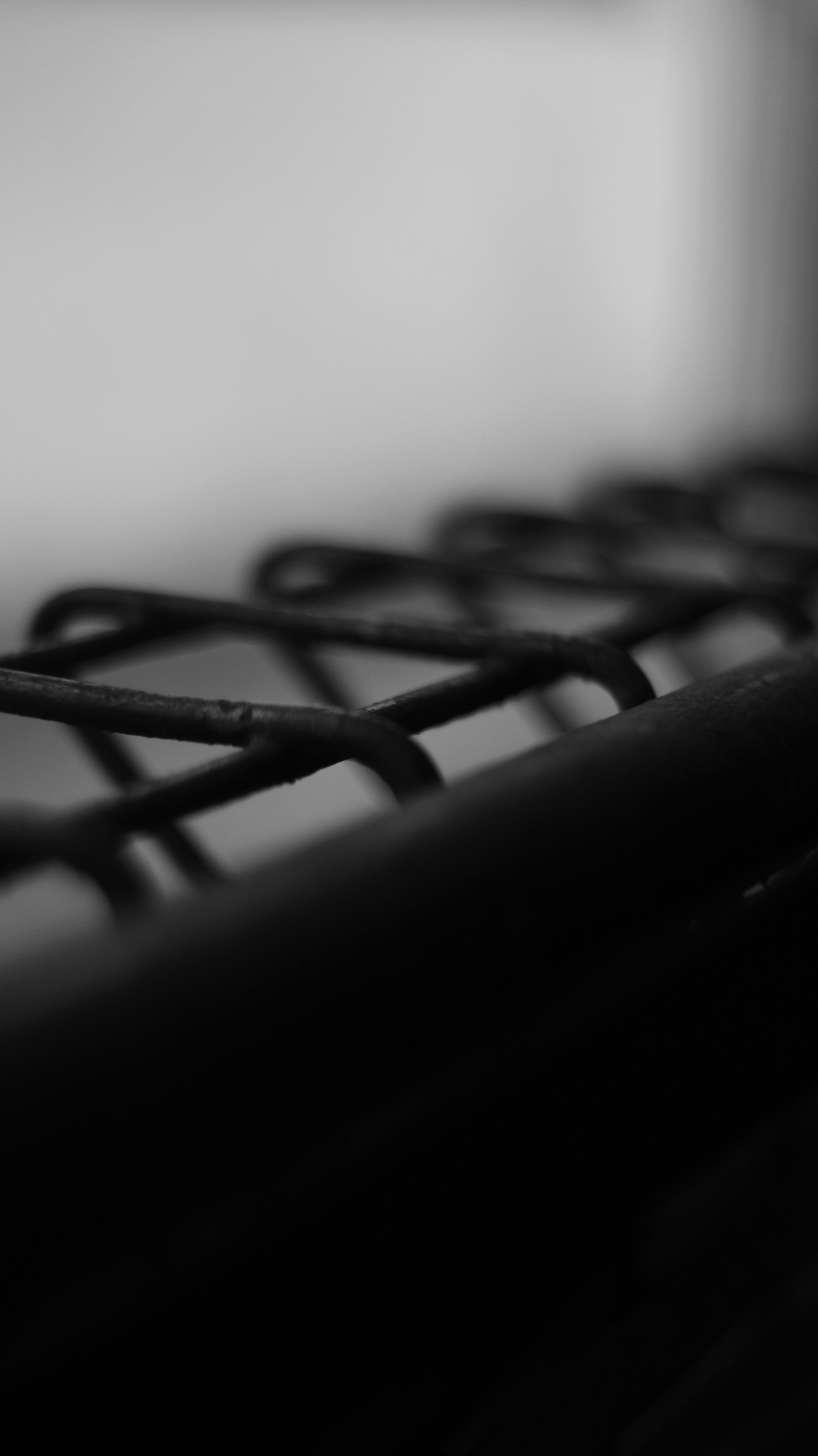 Quiet Geometry: Close-Up of Weathered Metal Loops