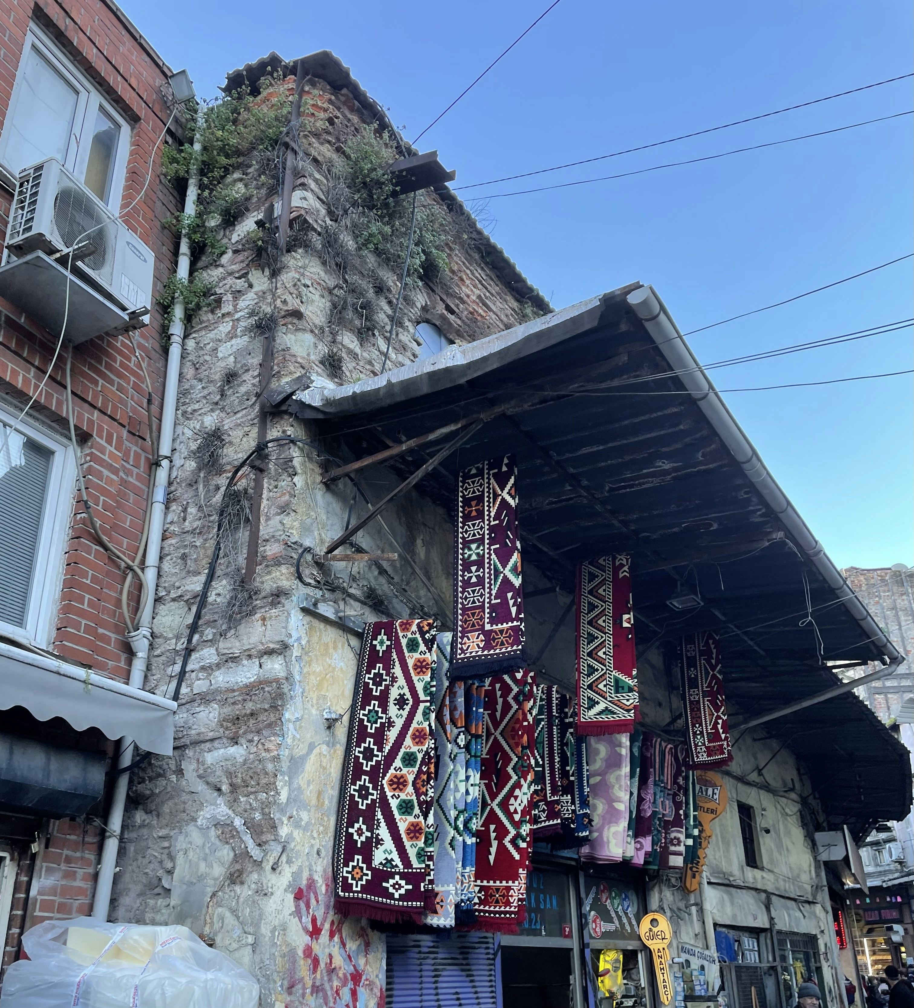 Colorful Rugs Draped Across a Timeworn Streetfront