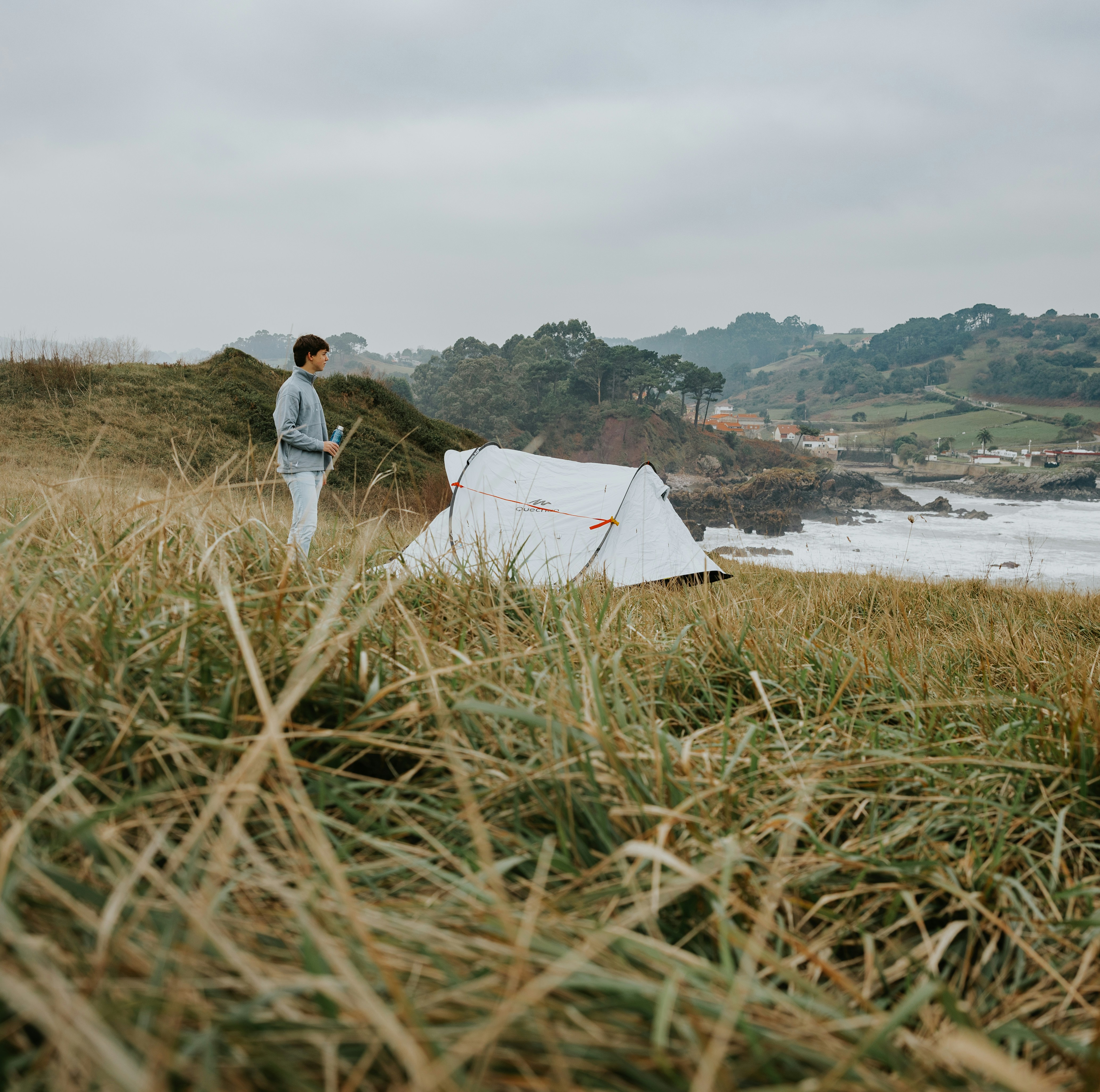 Onshore Quiet: A Lone Camper by Wind-Swept Dunes