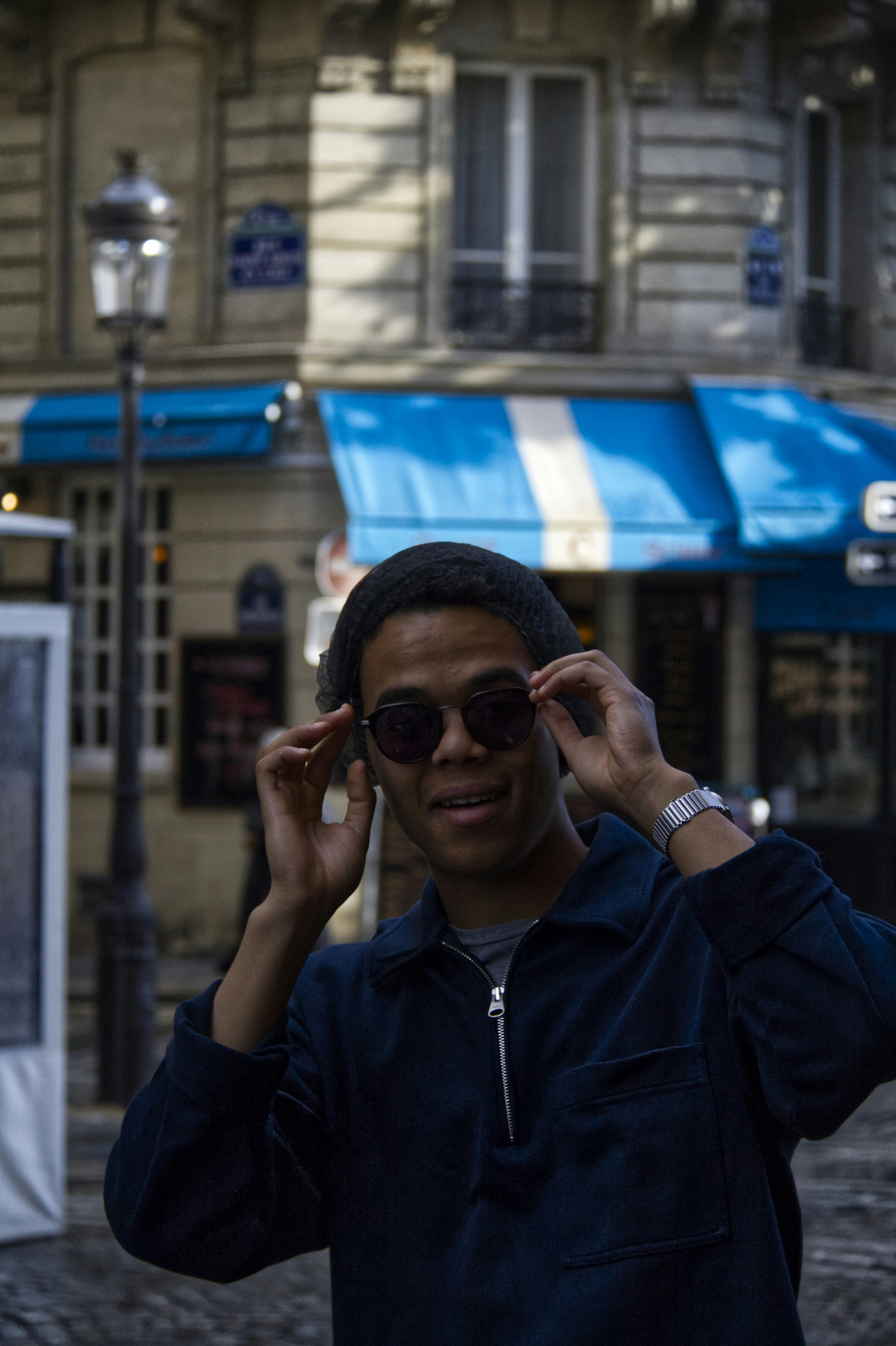 City Portrait in Shades: A Quiet Moment Behind Sunglasses