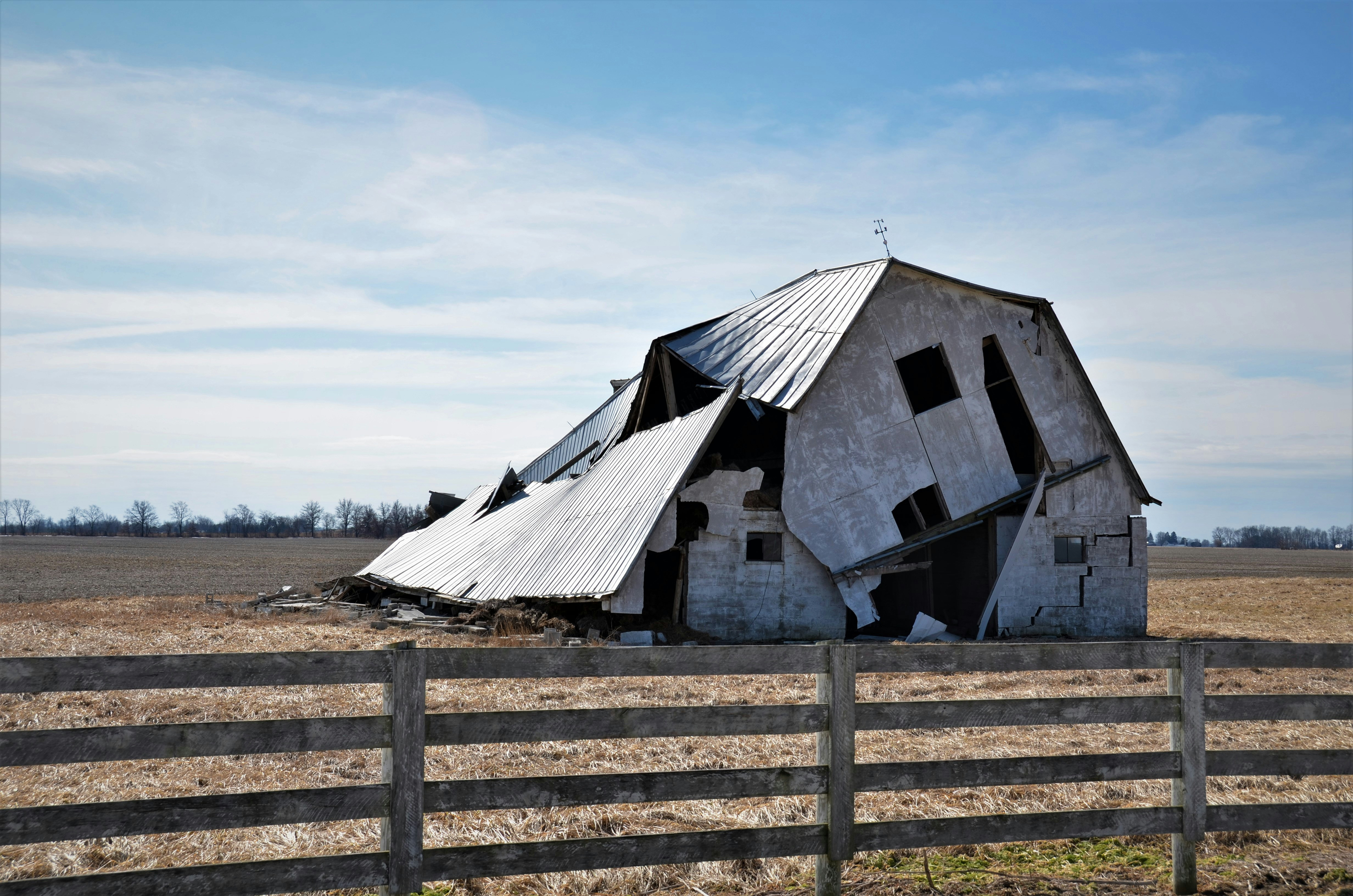 A barn that is falling apart in a field photo – Free Nature Image on ...