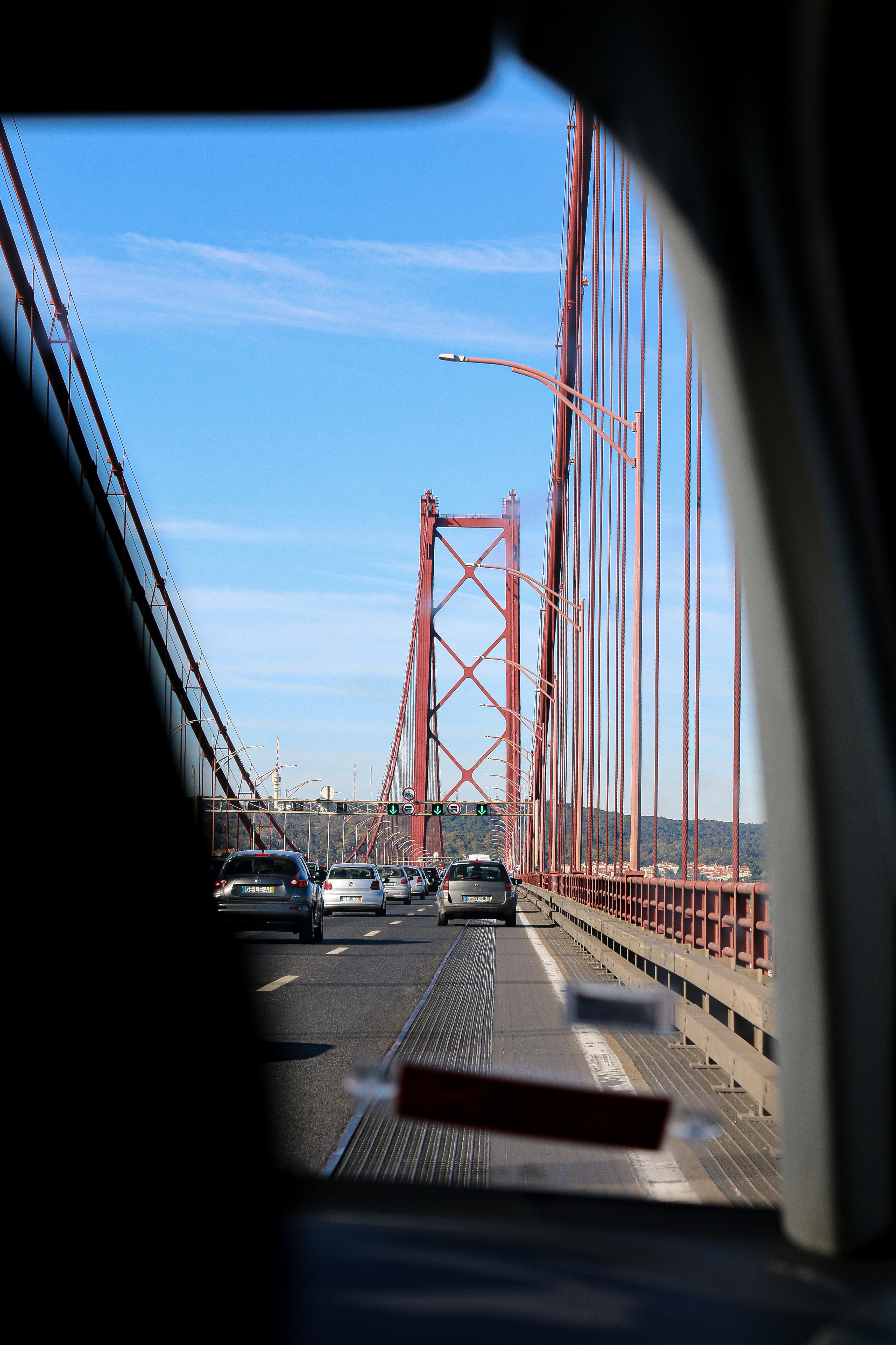 A view of a bridge from inside a car photo – Free Blue Image on Unsplash