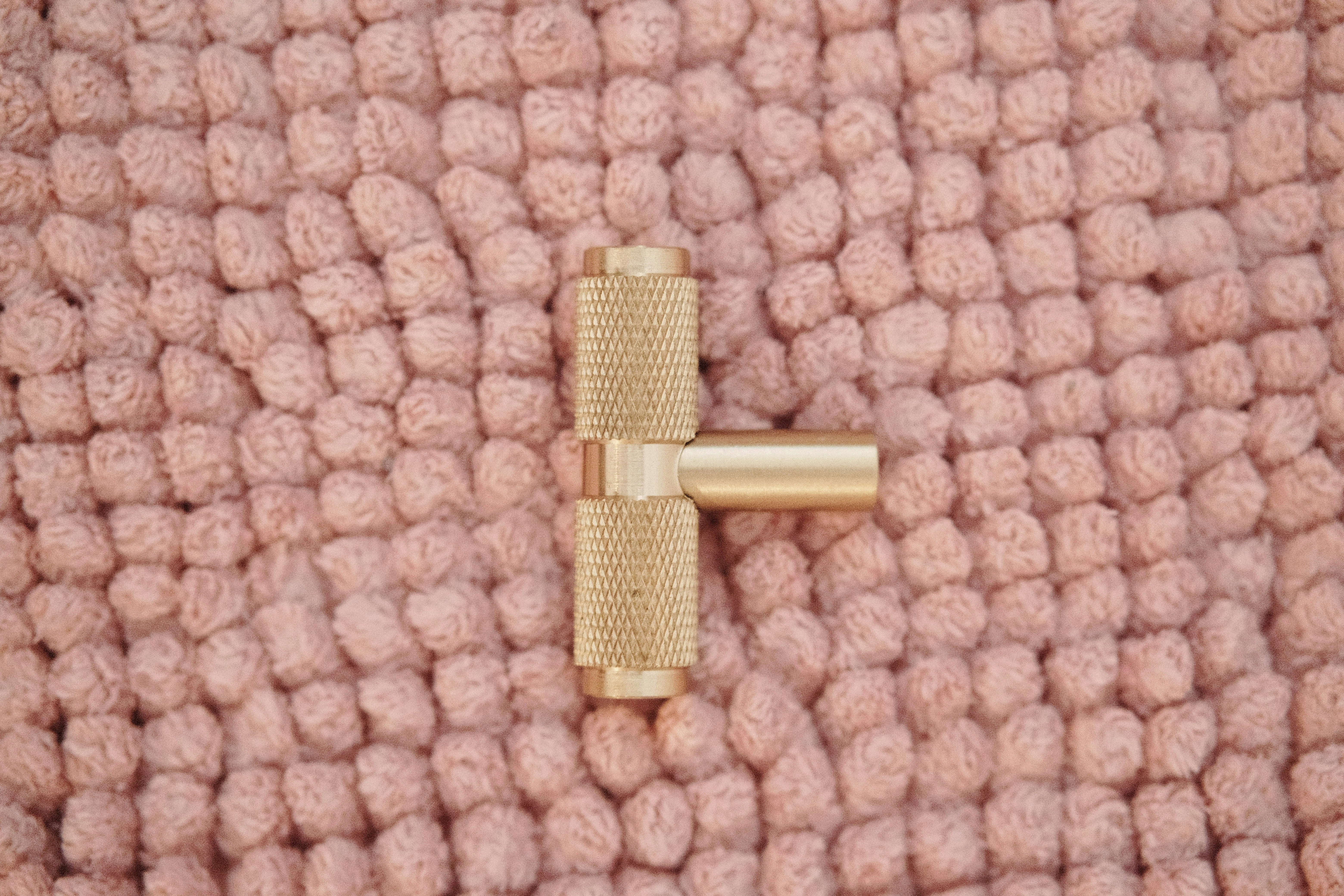 Tiny Knurled Gold T-Connector on Plush Pink Knit