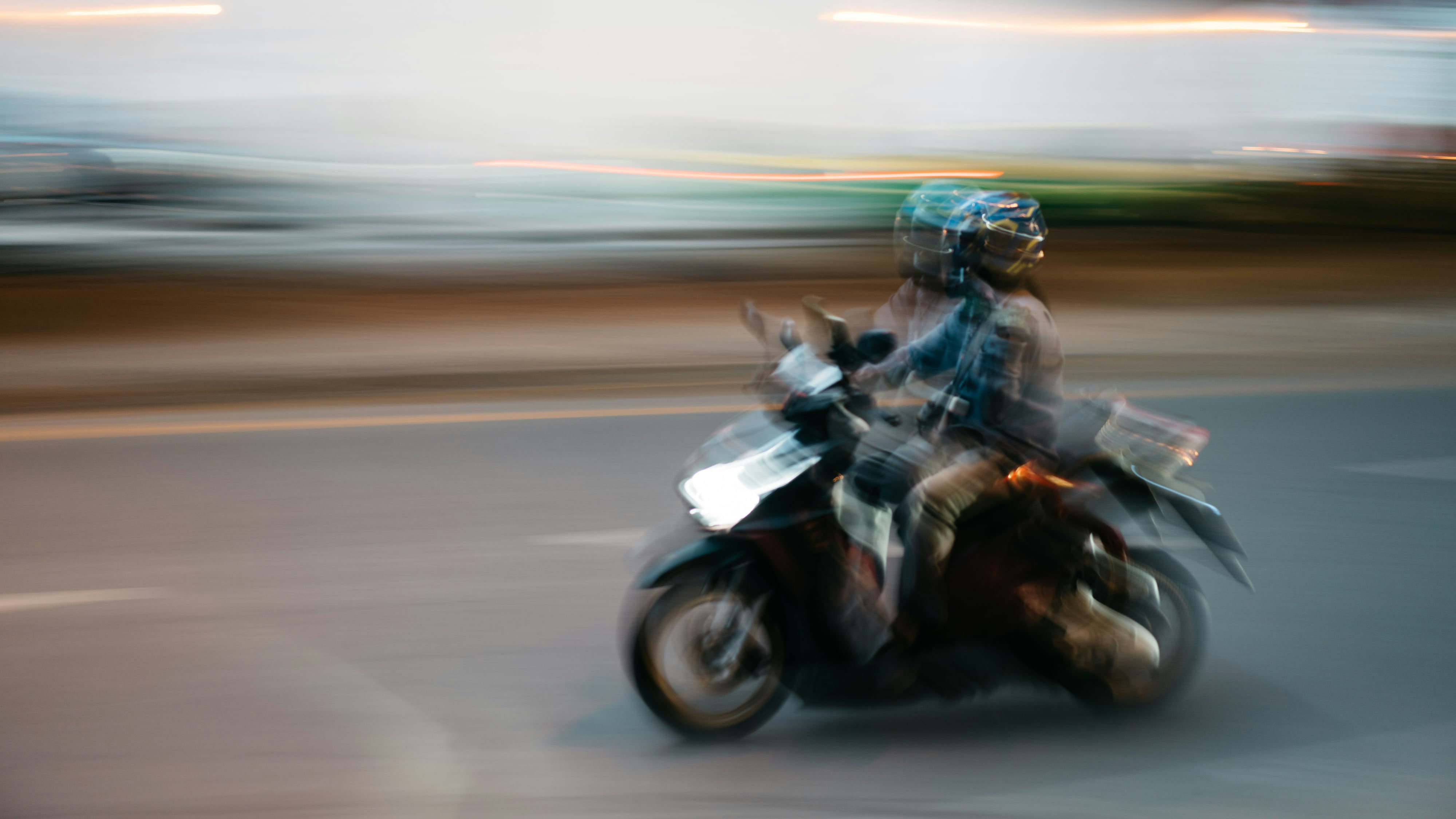 A blurry photo of a person riding a motorcycle photo – Free Thailand ...