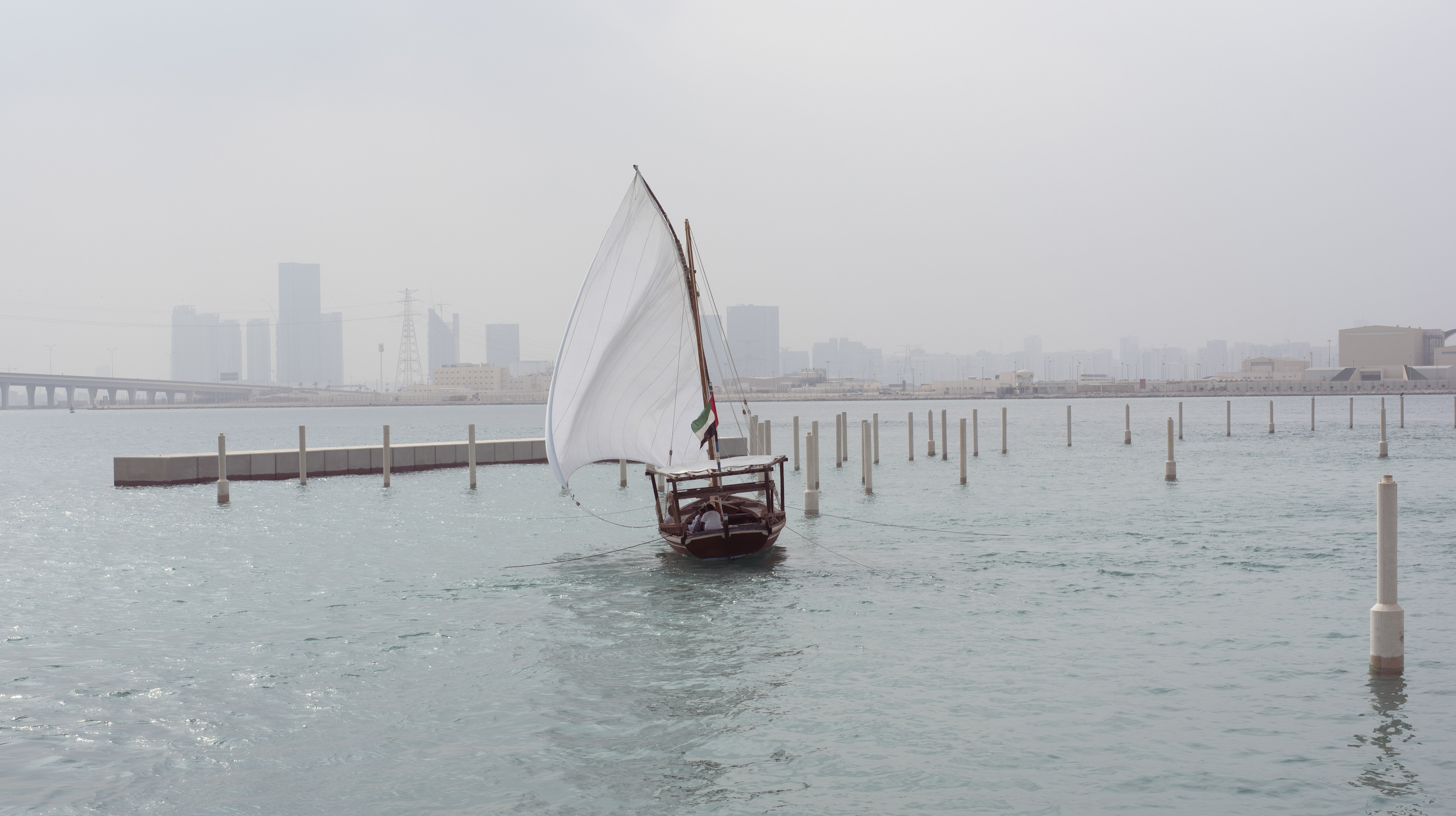 A small sailboat in the middle of a body of water photo – Free Sea ...