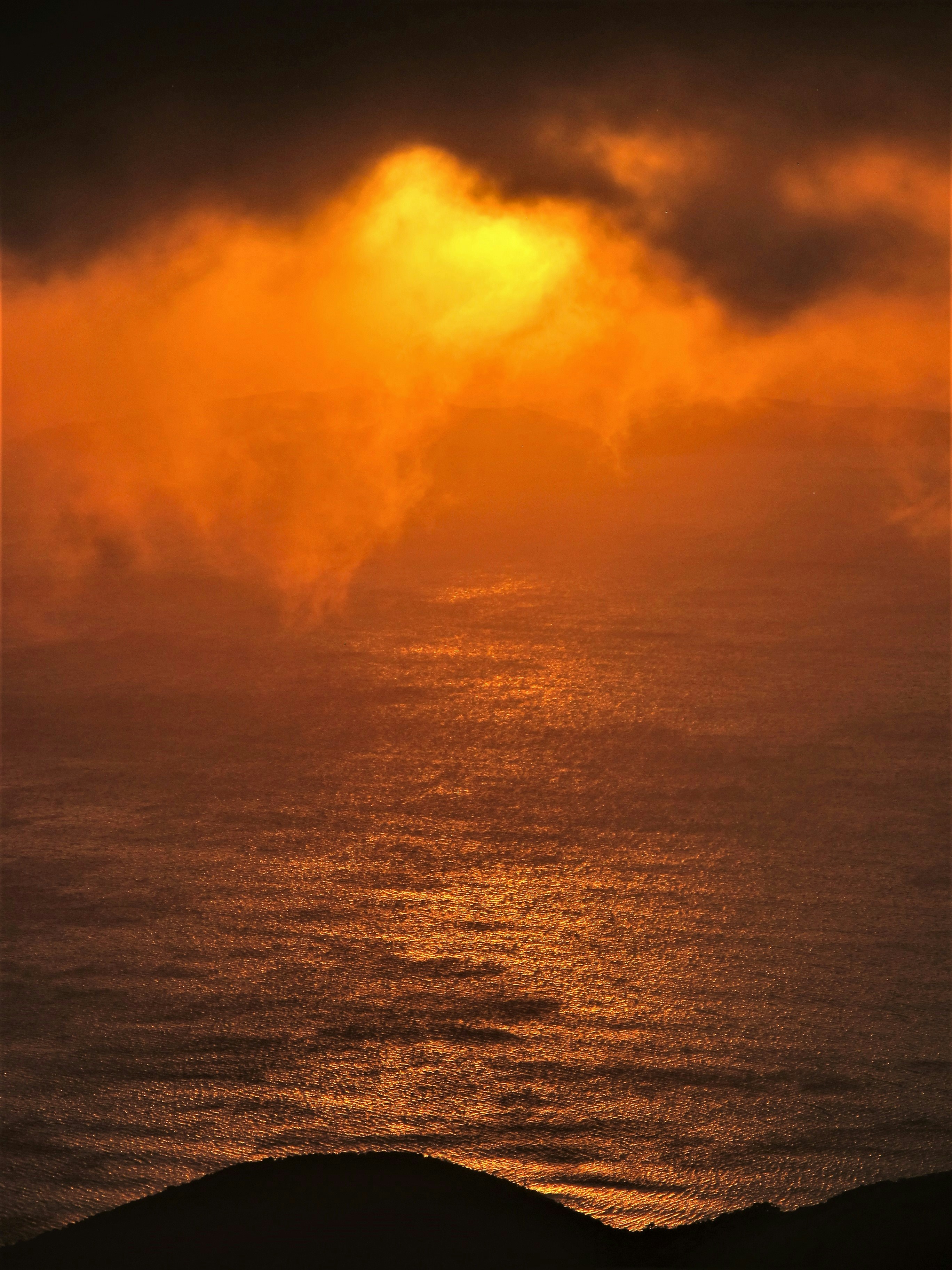 Clouds interrupting a nice sunset.
