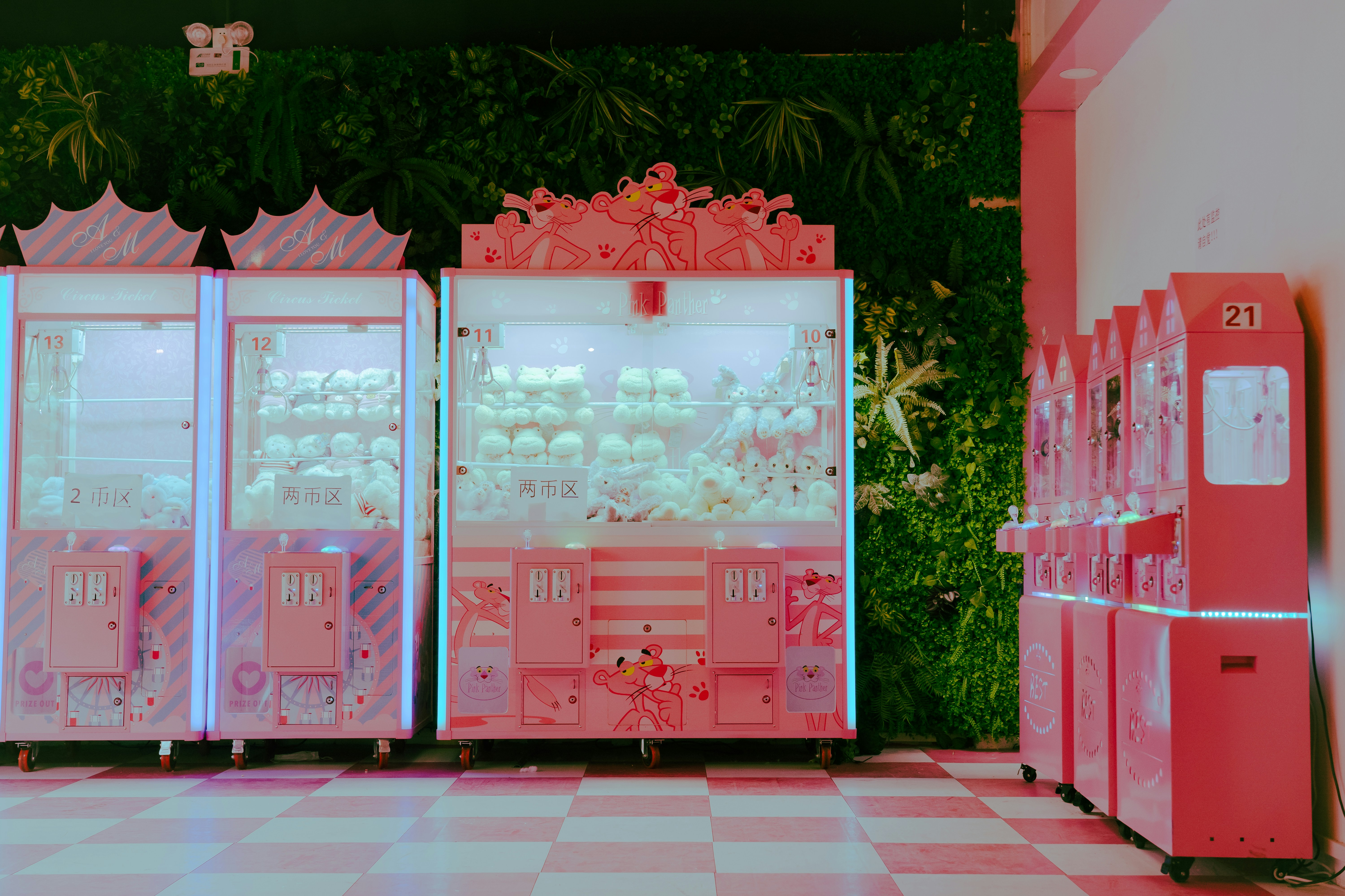 A row of pink vending machines sitting next to each other photo – Free ...