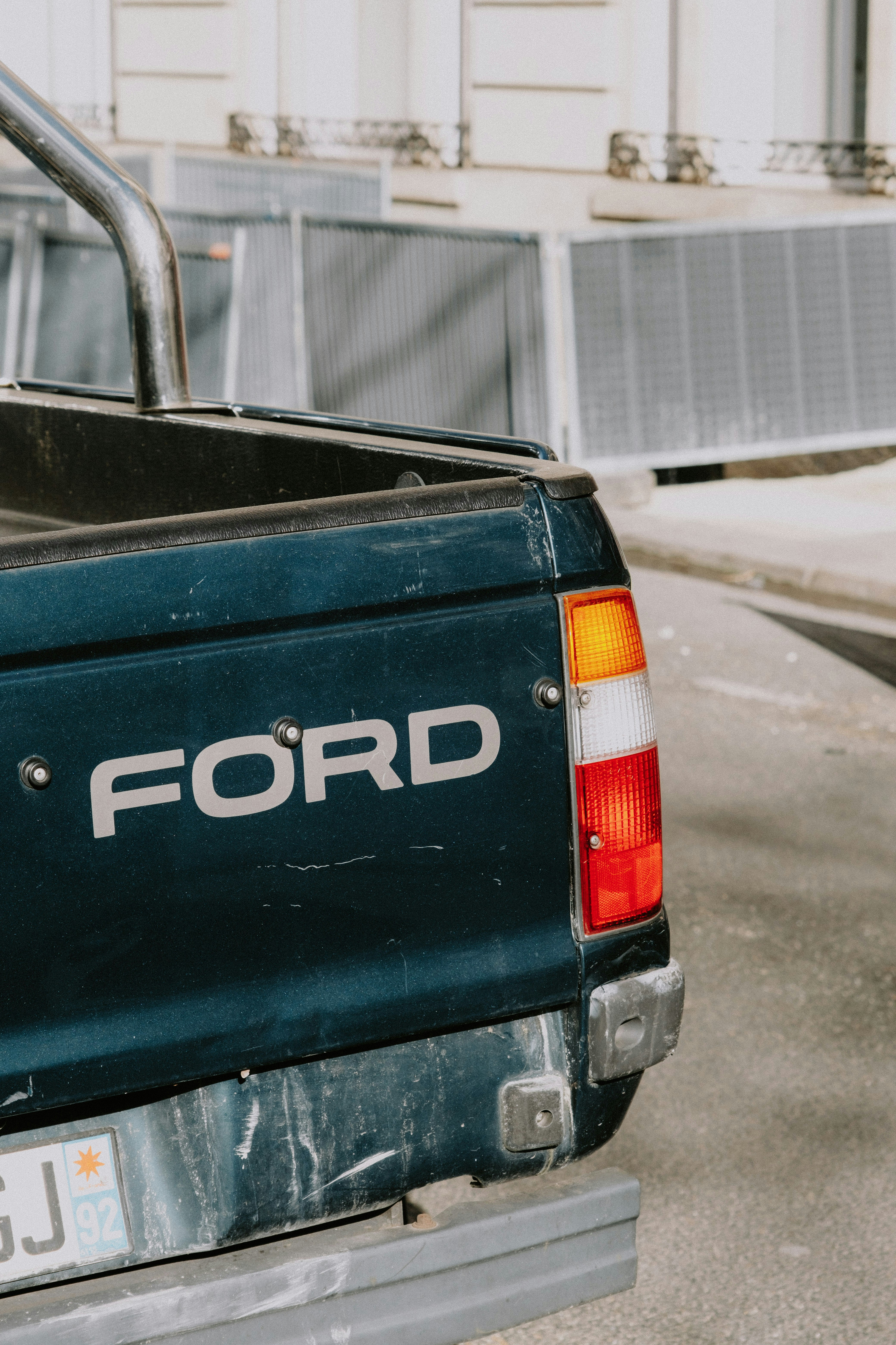 Rear View of a Weathered Ford Pickup in an Urban Quiet