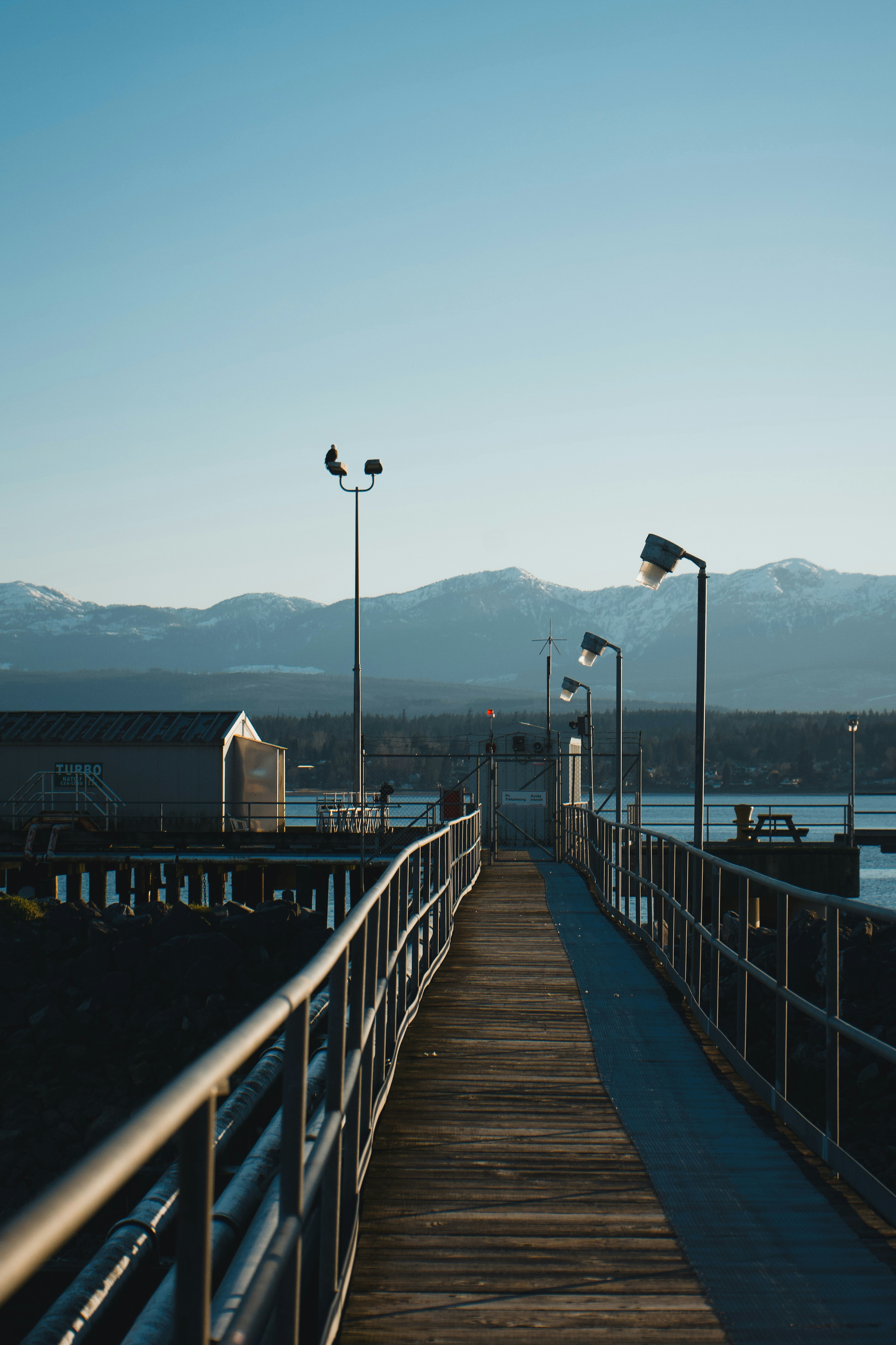 A pier with a light pole and street lamps photo – Free Vancouver Image ...