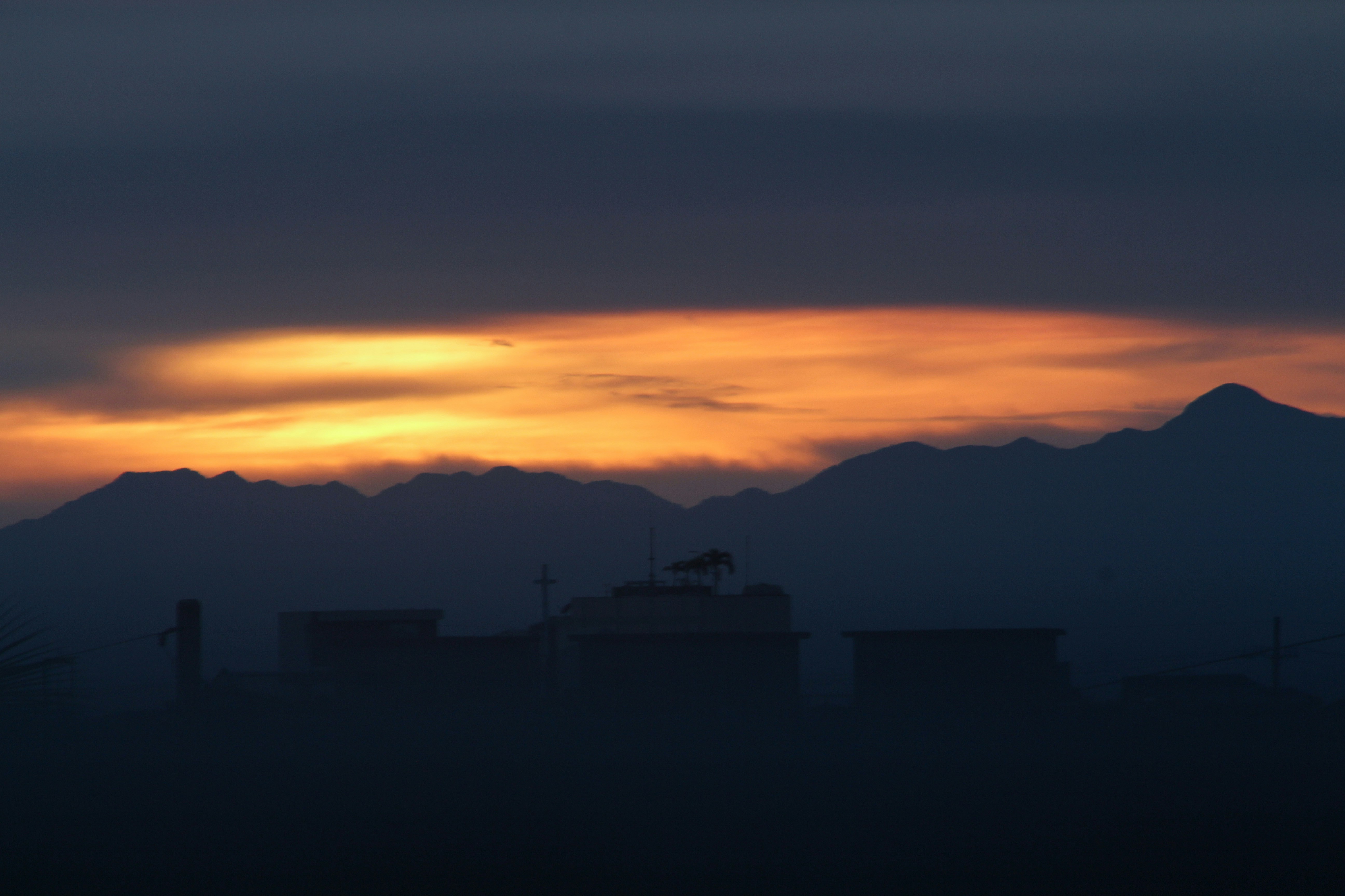 Horizon Ember Over a Quiet Skyline at Dusk