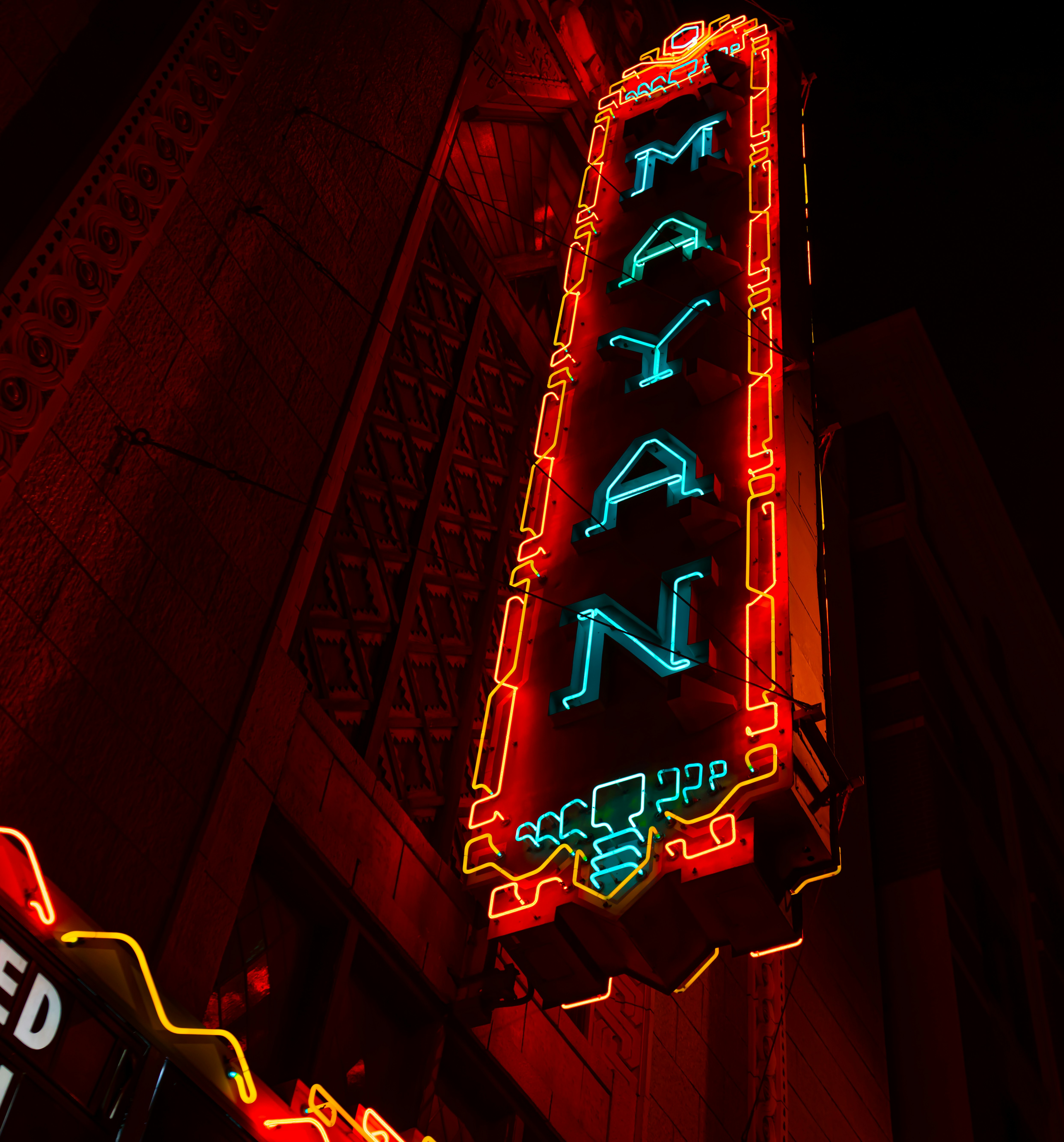 Neon Mayan: A Night Sign Basking in Electric Red