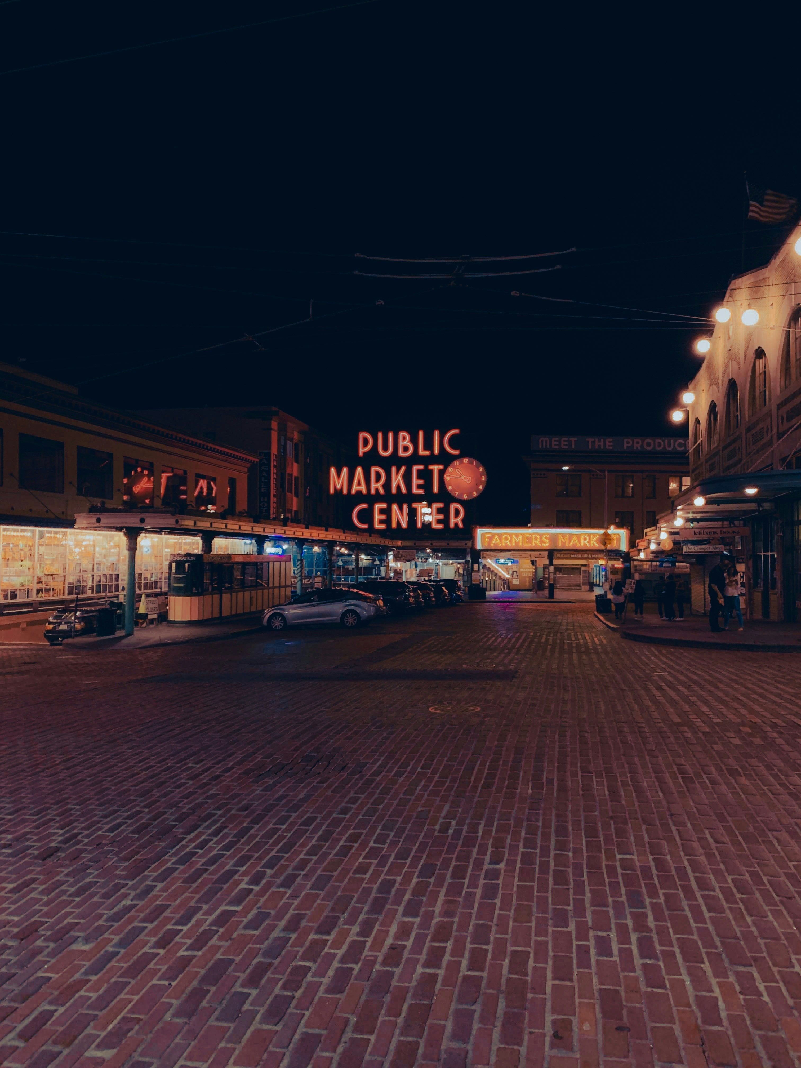 A public market center sign lit up at night photo – Free United states ...