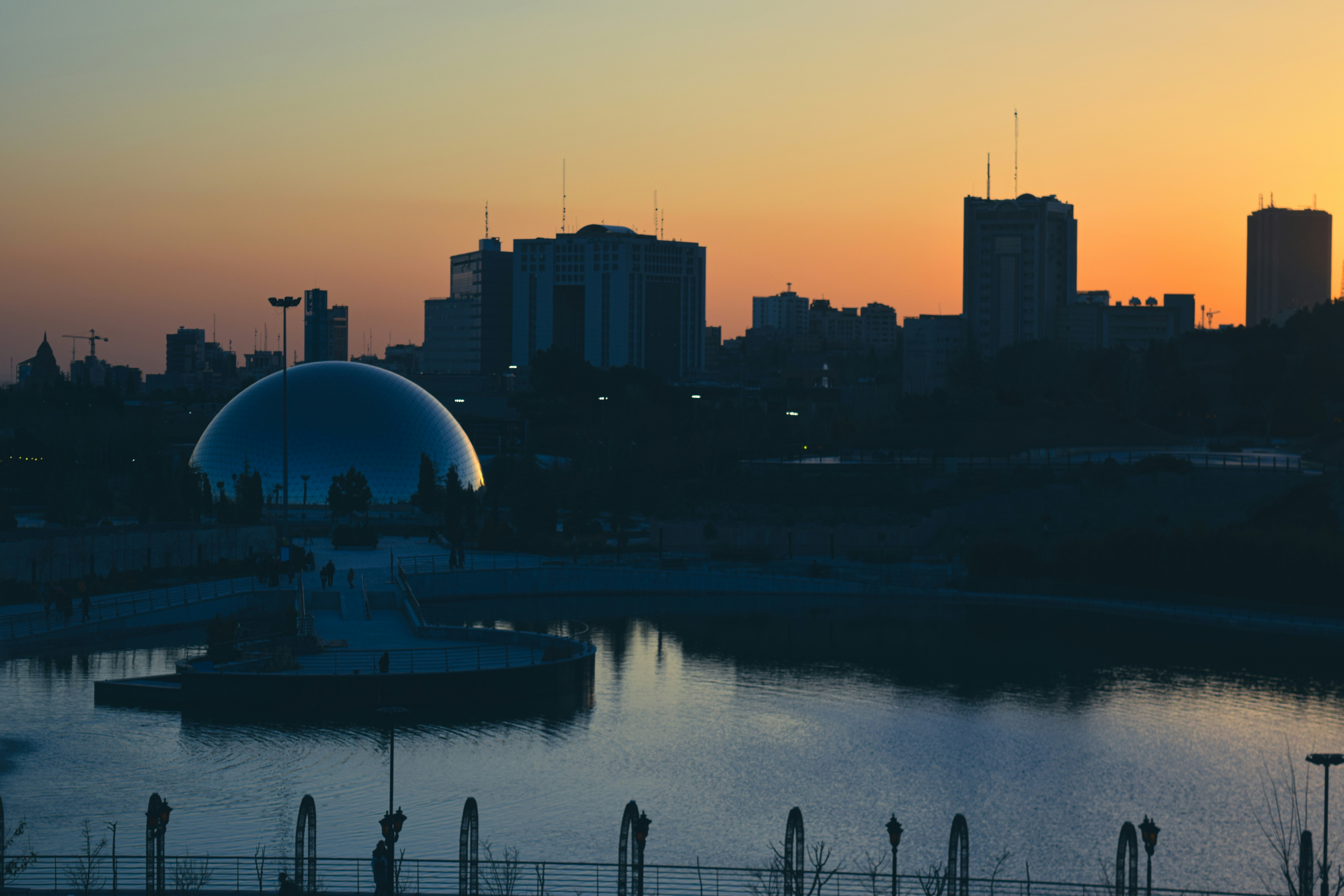 Dusk Echoes: The Glass Dome Against a Sleeping Skyline