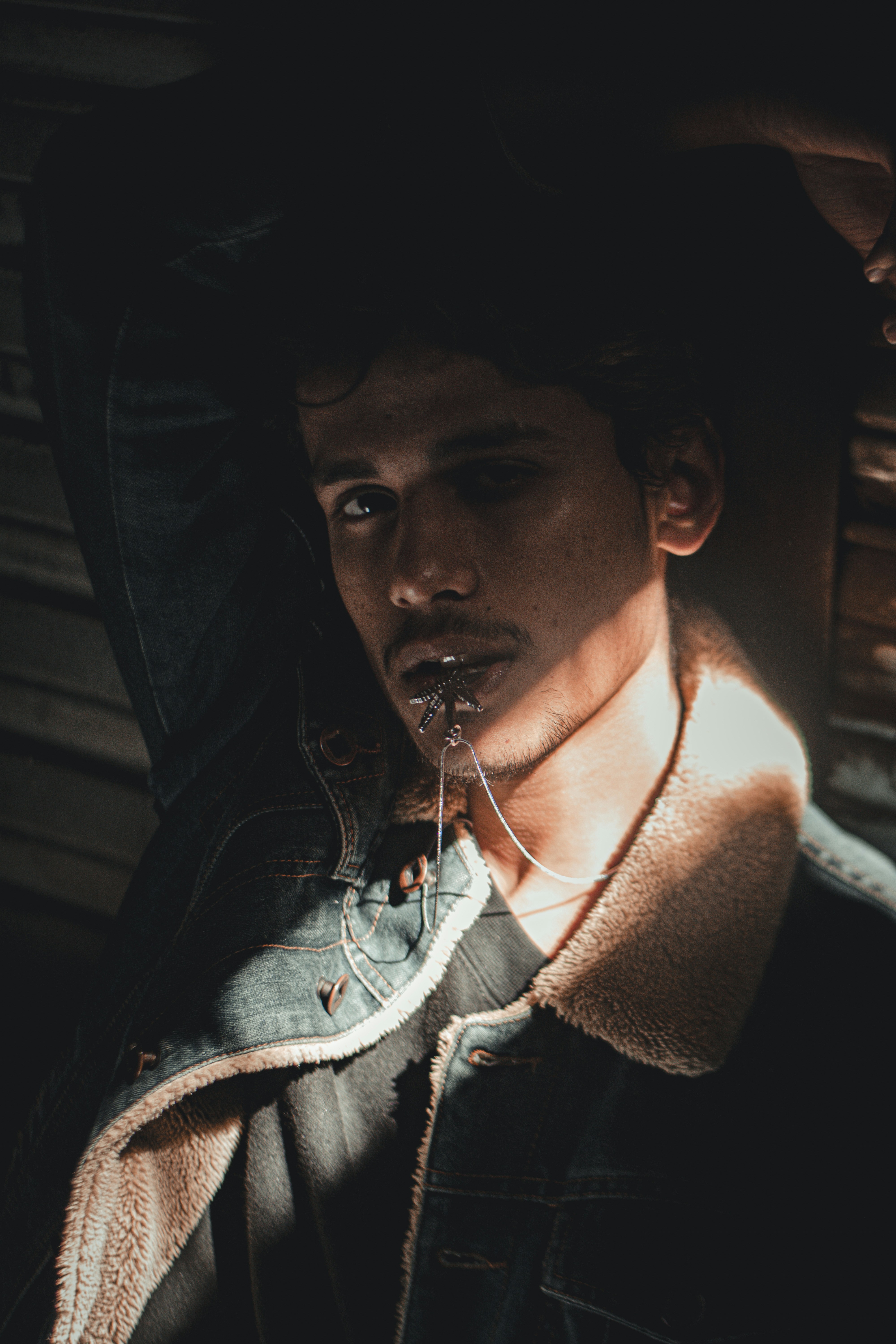 A man with a piercing in his ear photo – Free Clothing Image on Unsplash