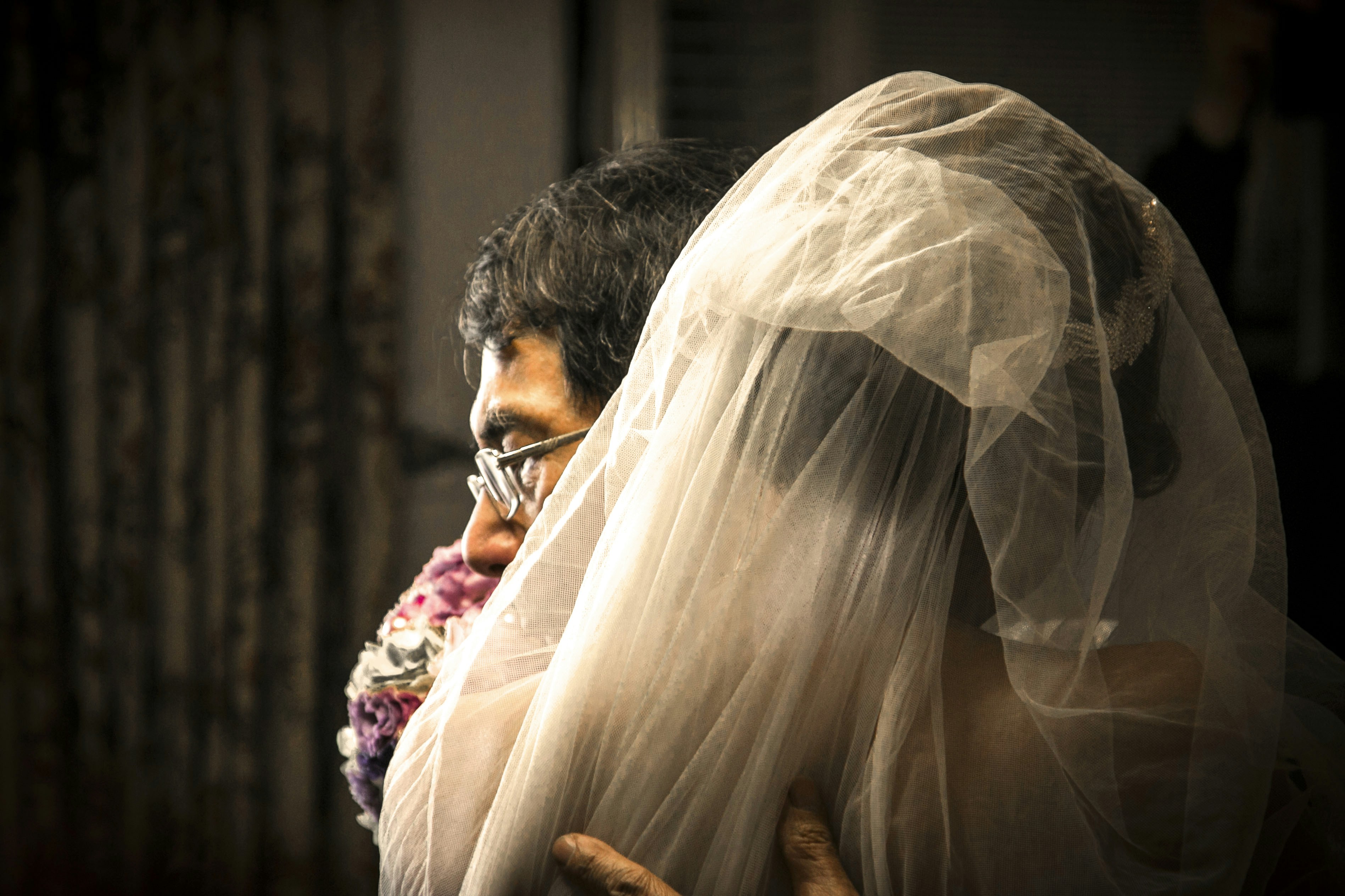 Veiled Moment: A Tender Portrait in Amber Light