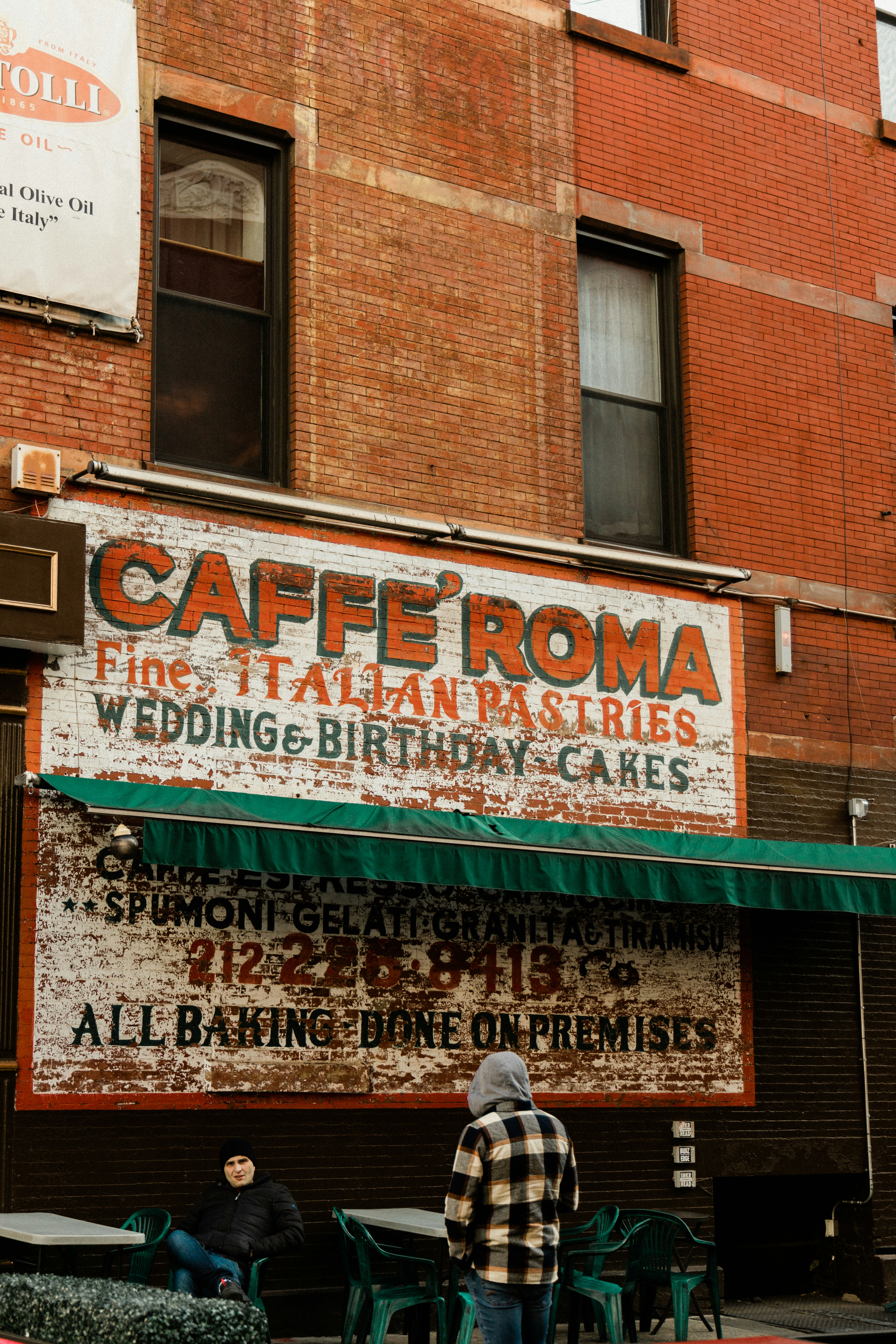 Weathered Caffè Roma Sign Anchoring a Quiet City Café