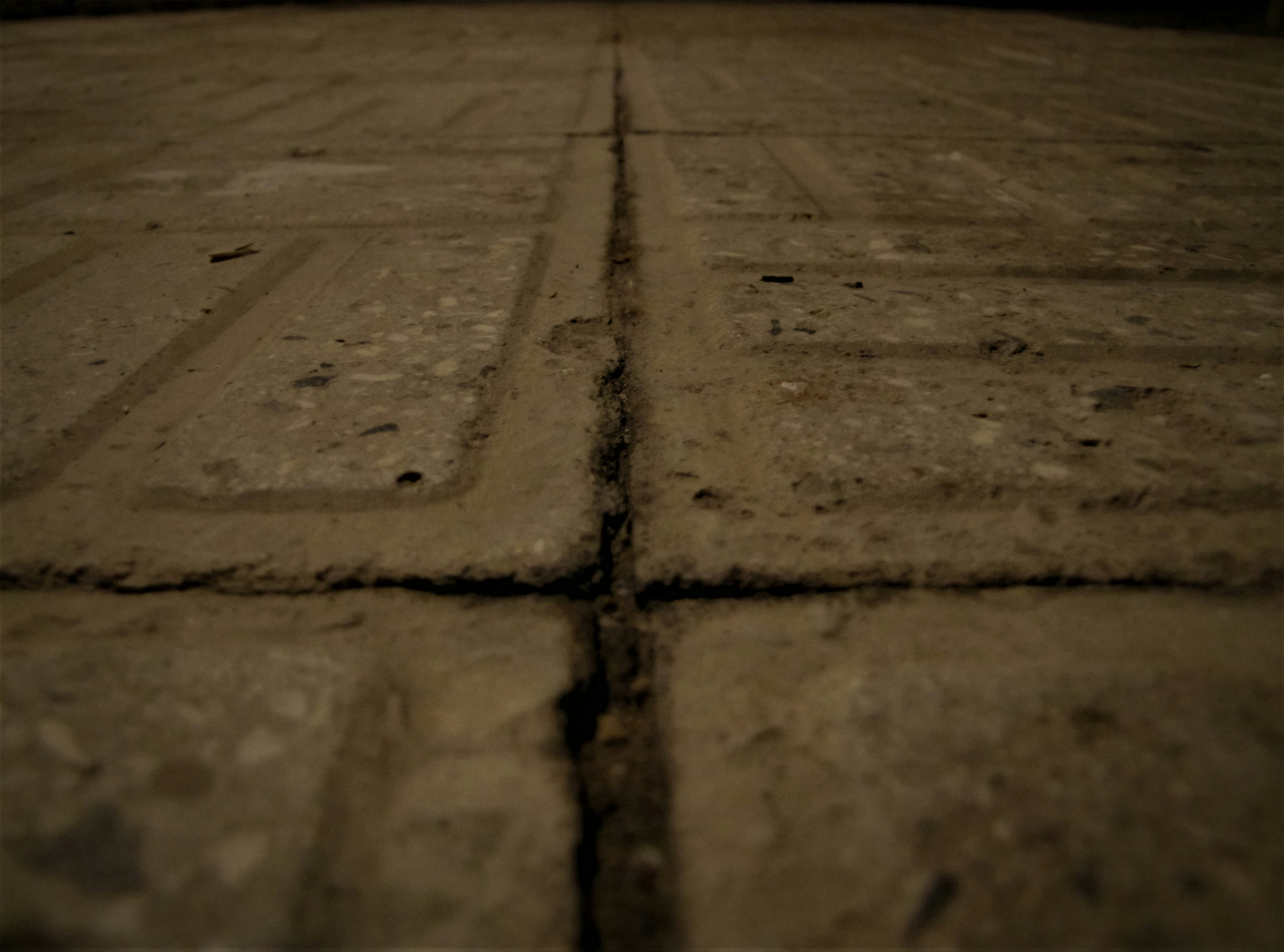 A close up of a cement slab with a stop sign in the background photo ...
