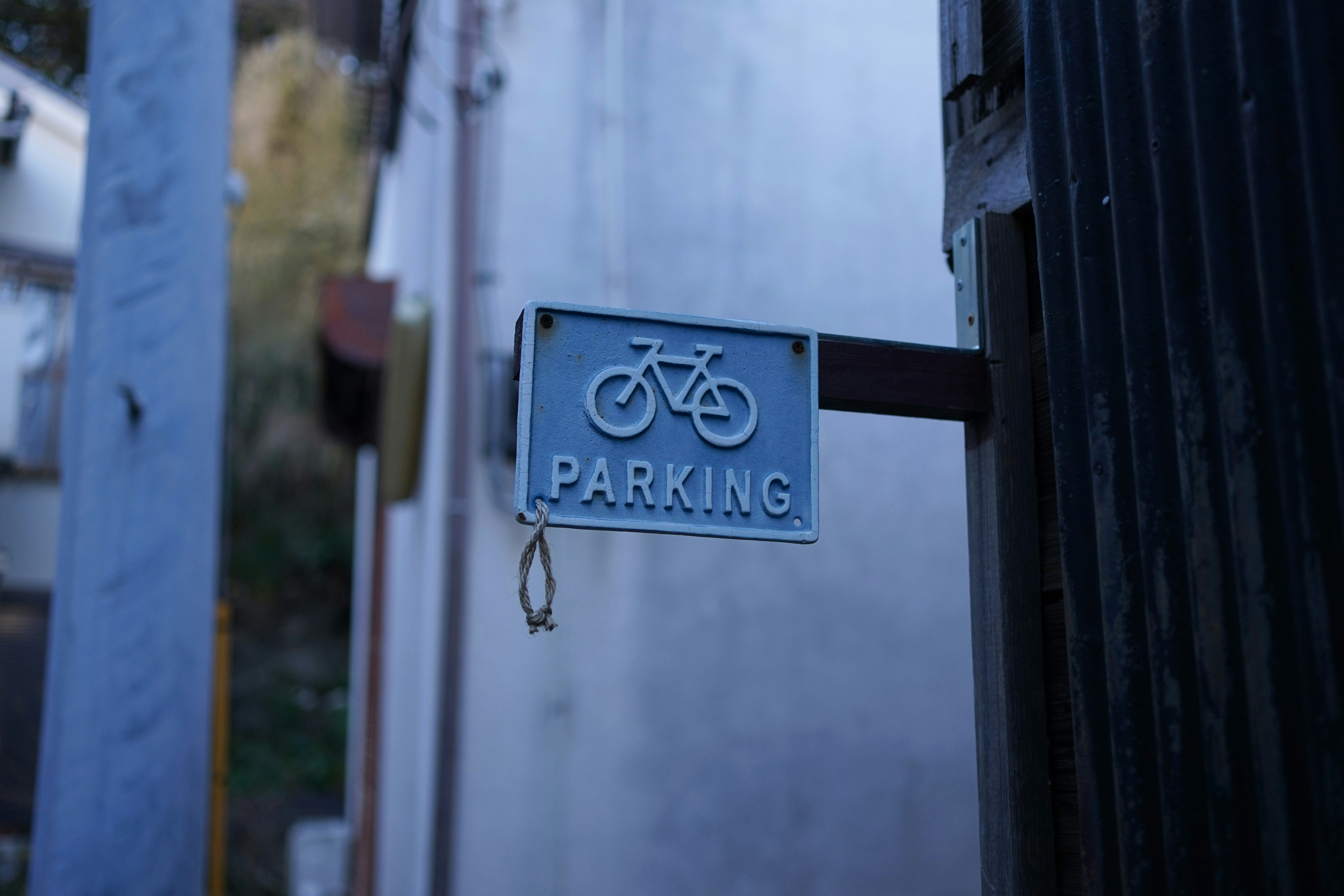 Weathered Parking Sign on a Quiet Industrial Lane