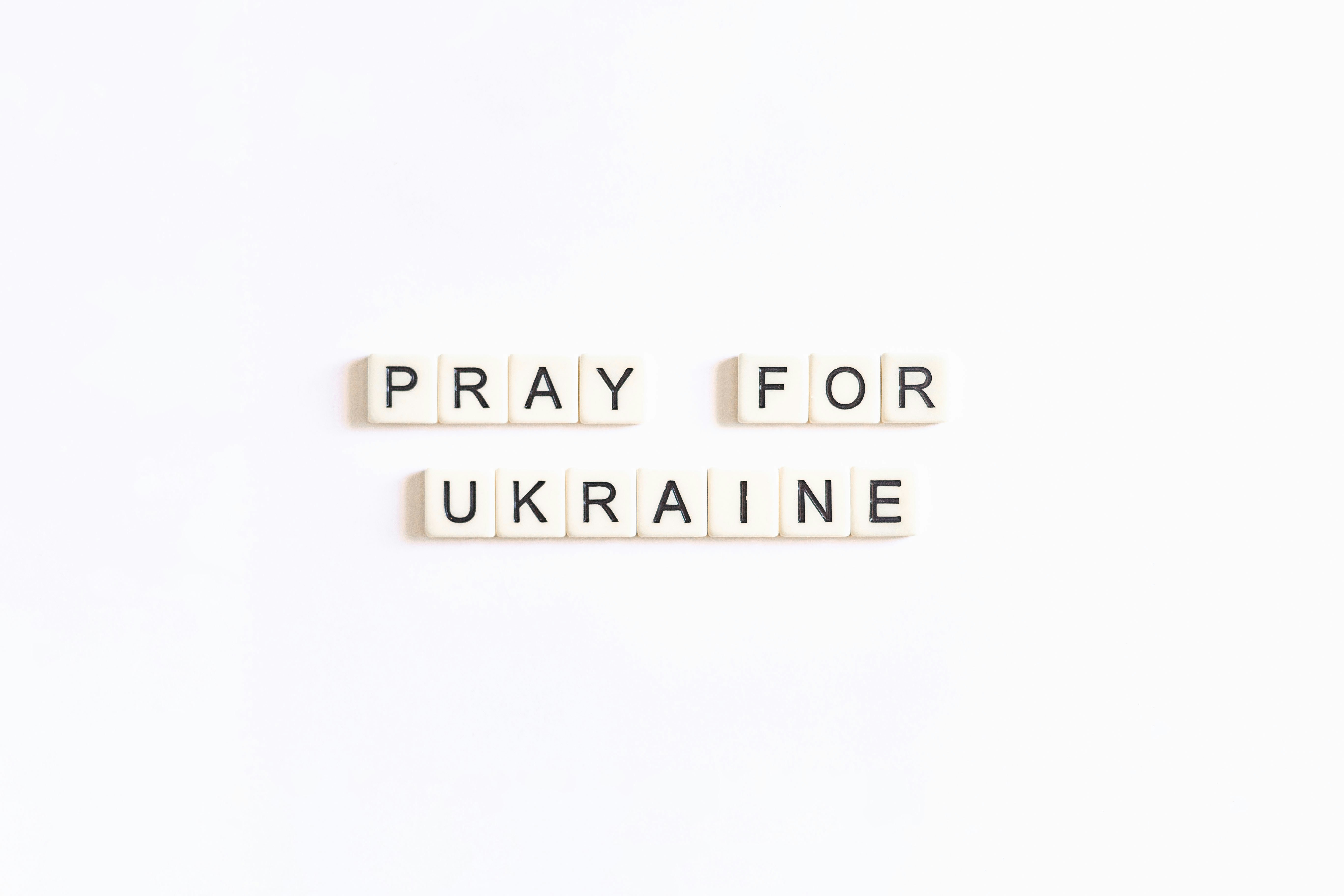 the word pray for ukraine spelled with scrabble letters