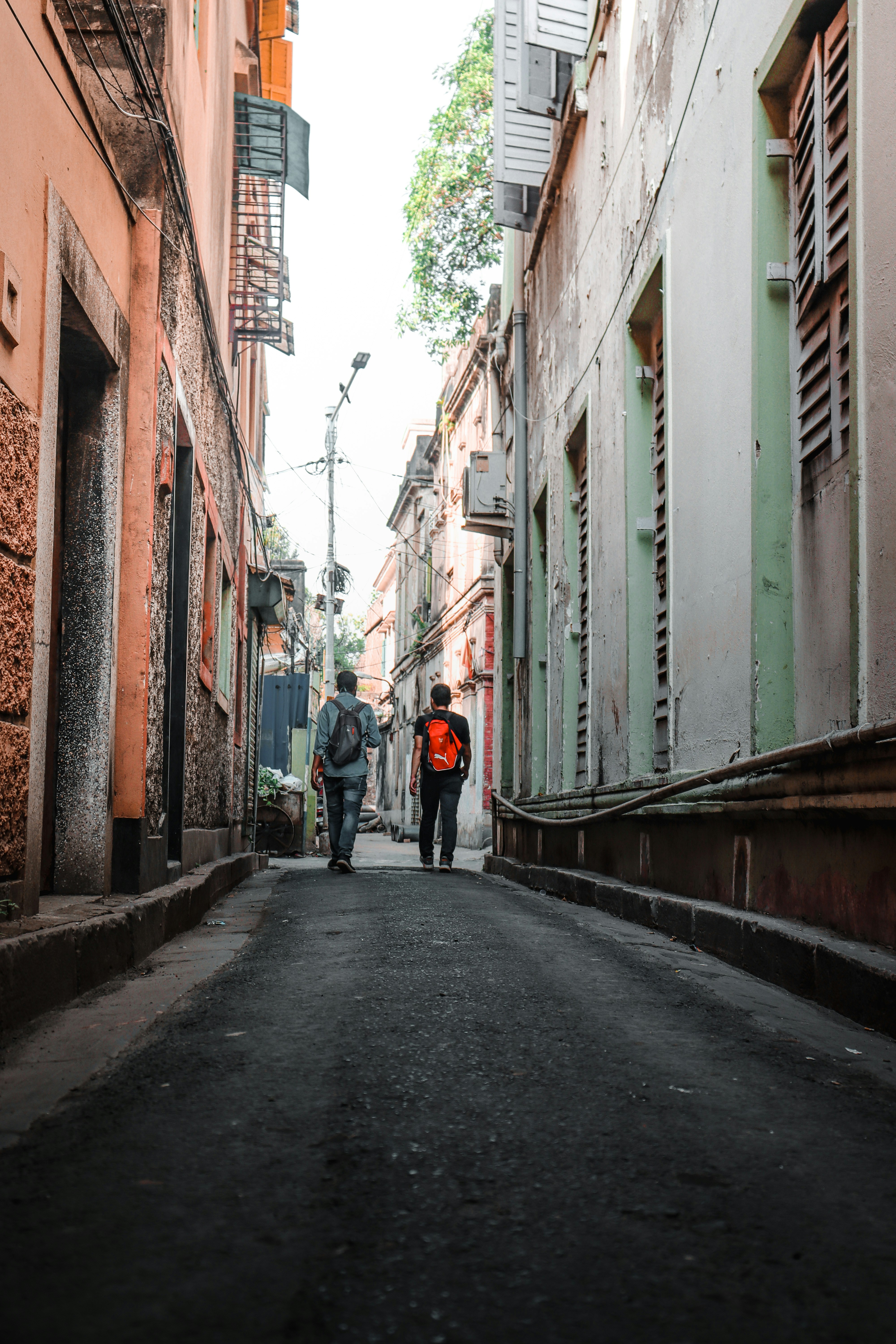 Two Explorers in a Narrow Dawn Alley