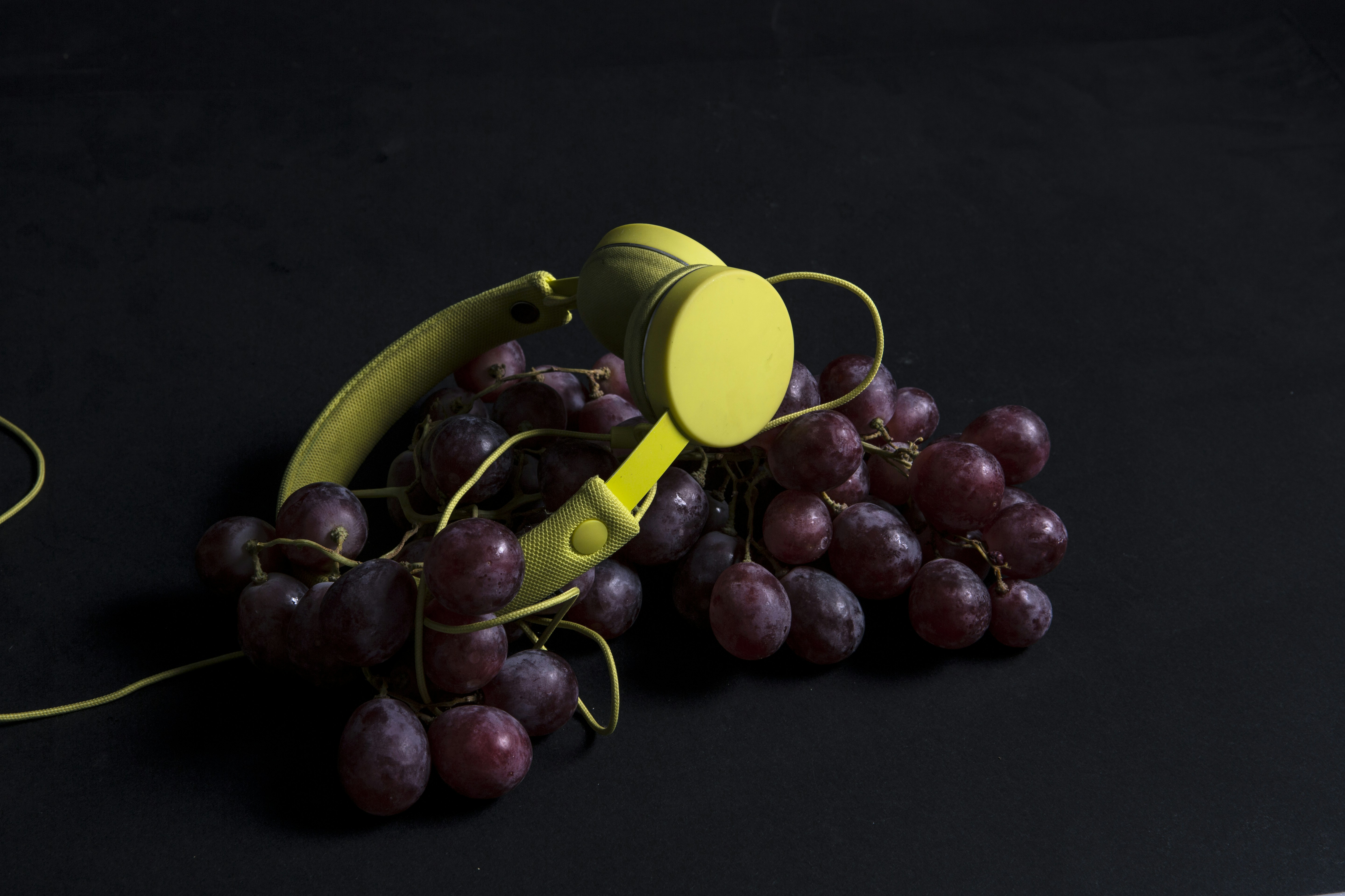 a bunch of grapes sitting on top of a table