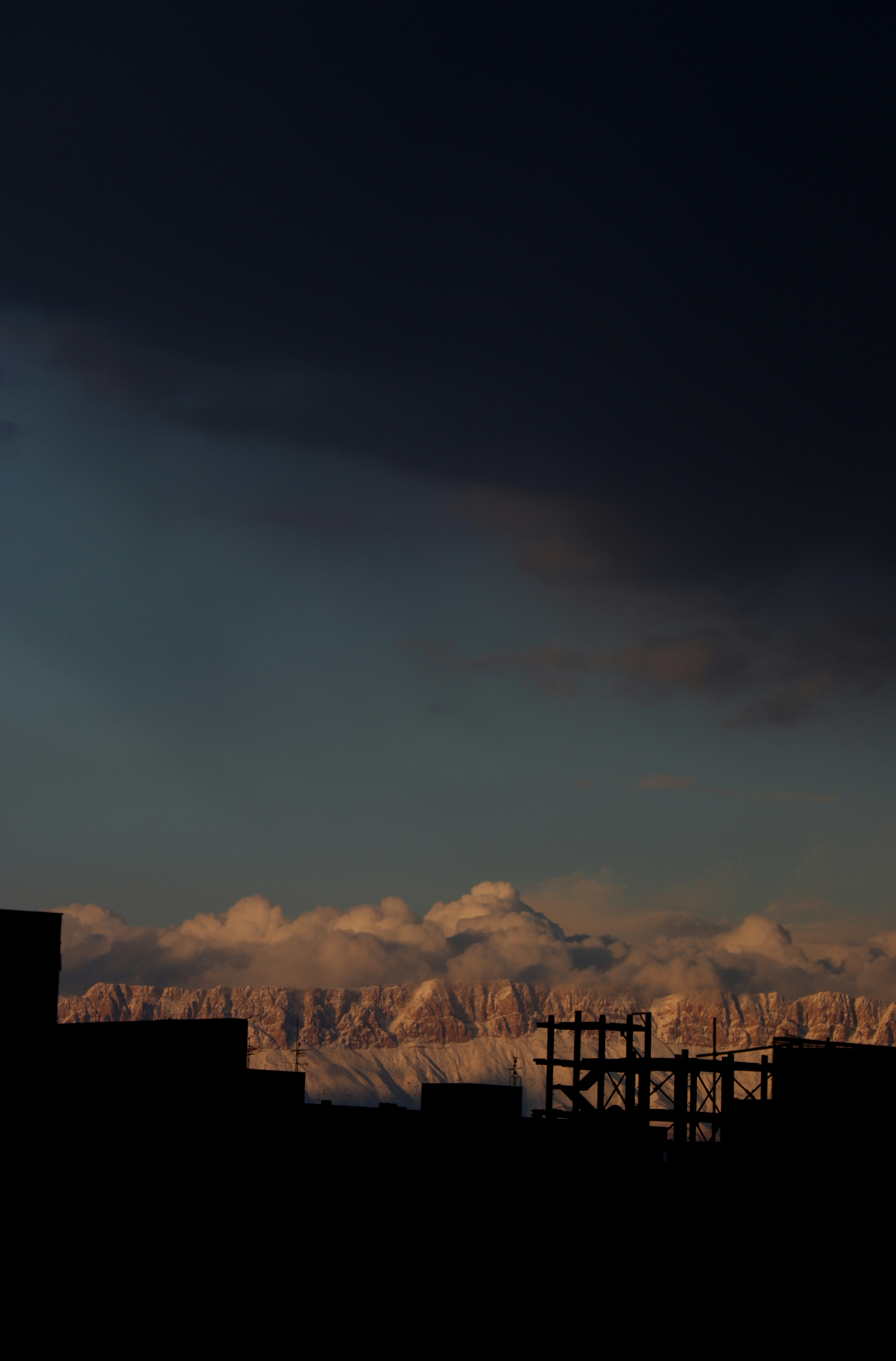 Snowlit Ridge Framed by a Silent Dusk Skyline