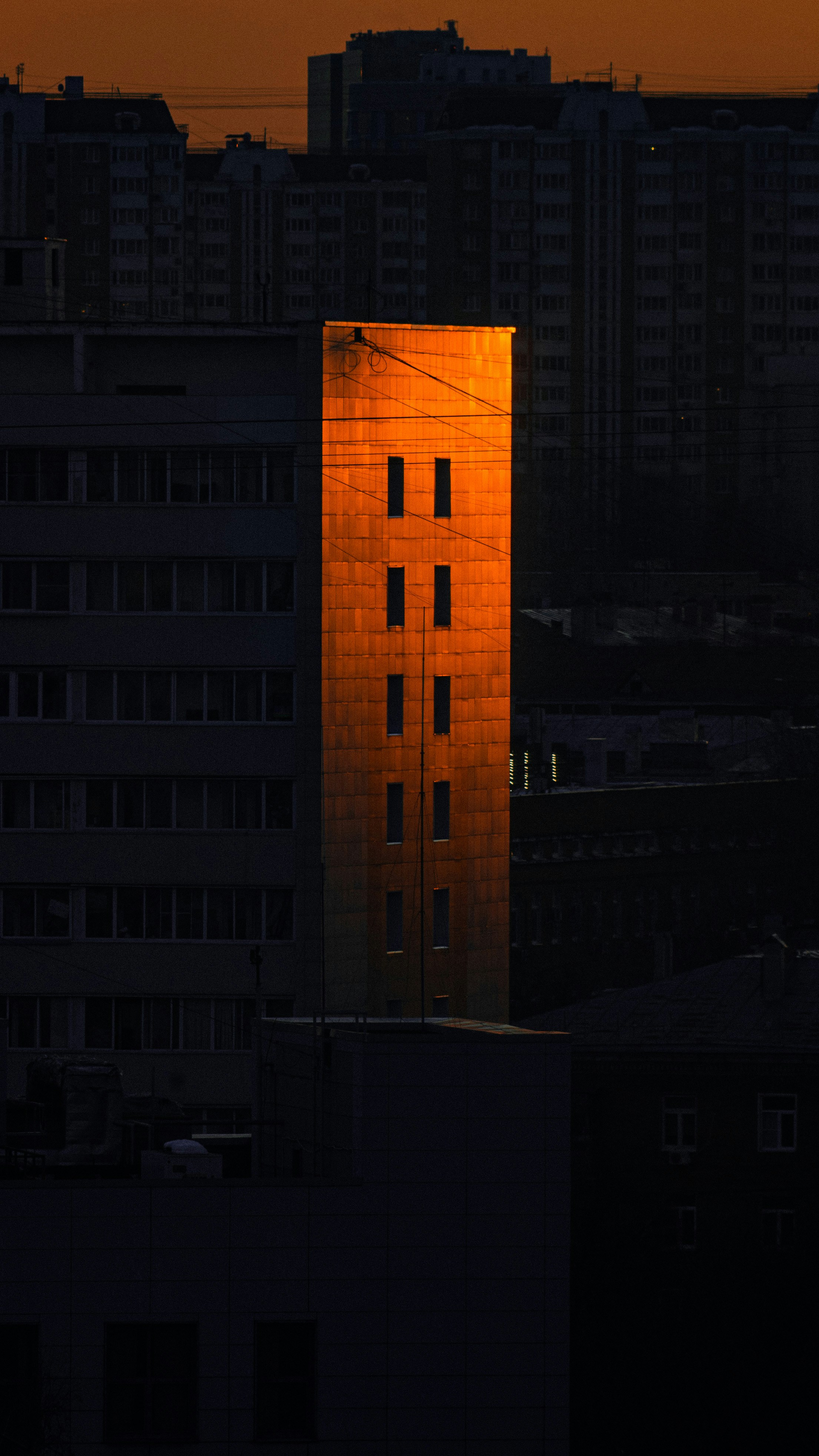 a tall building lit up at night