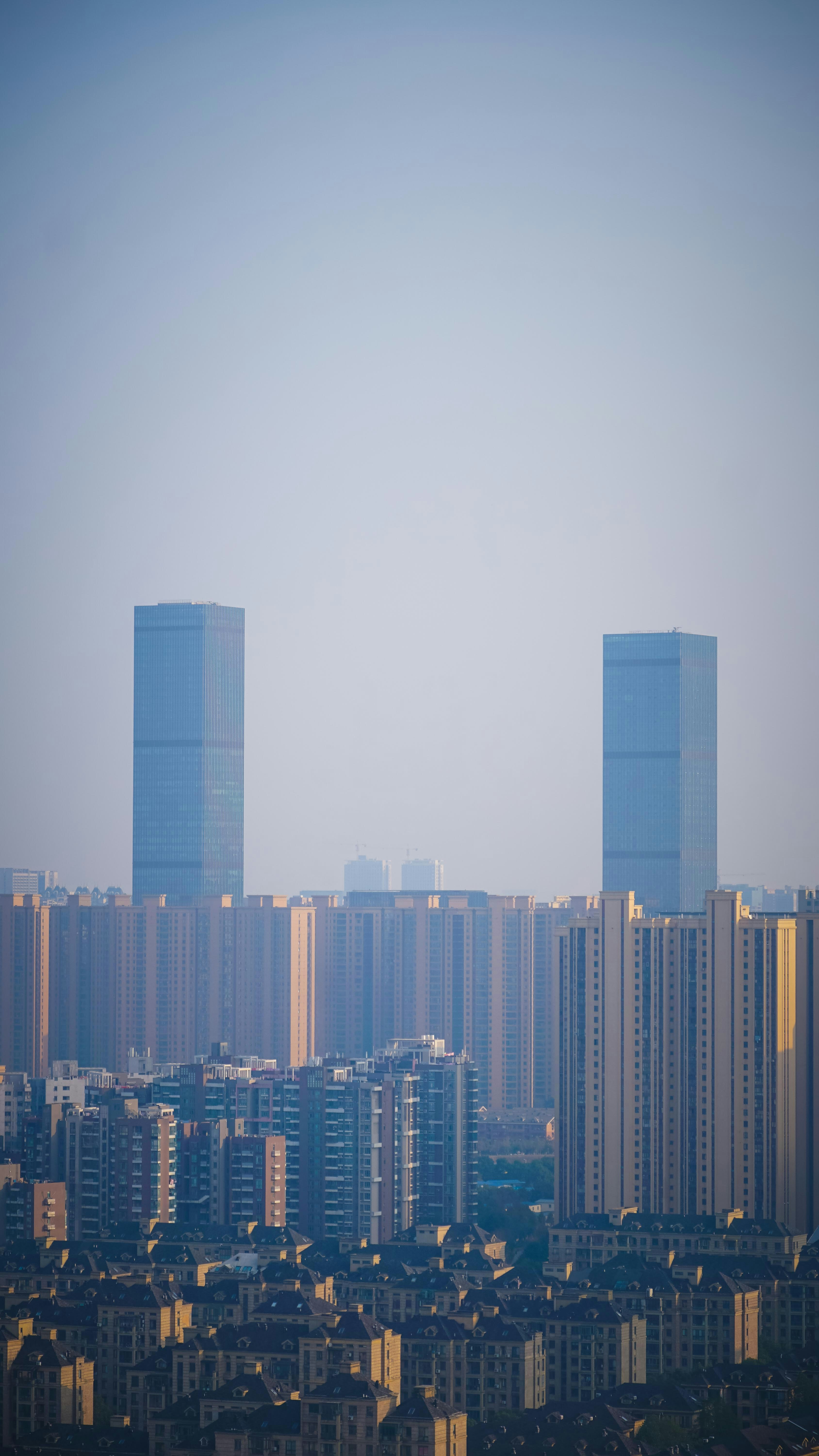 a view of a city with tall buildings
