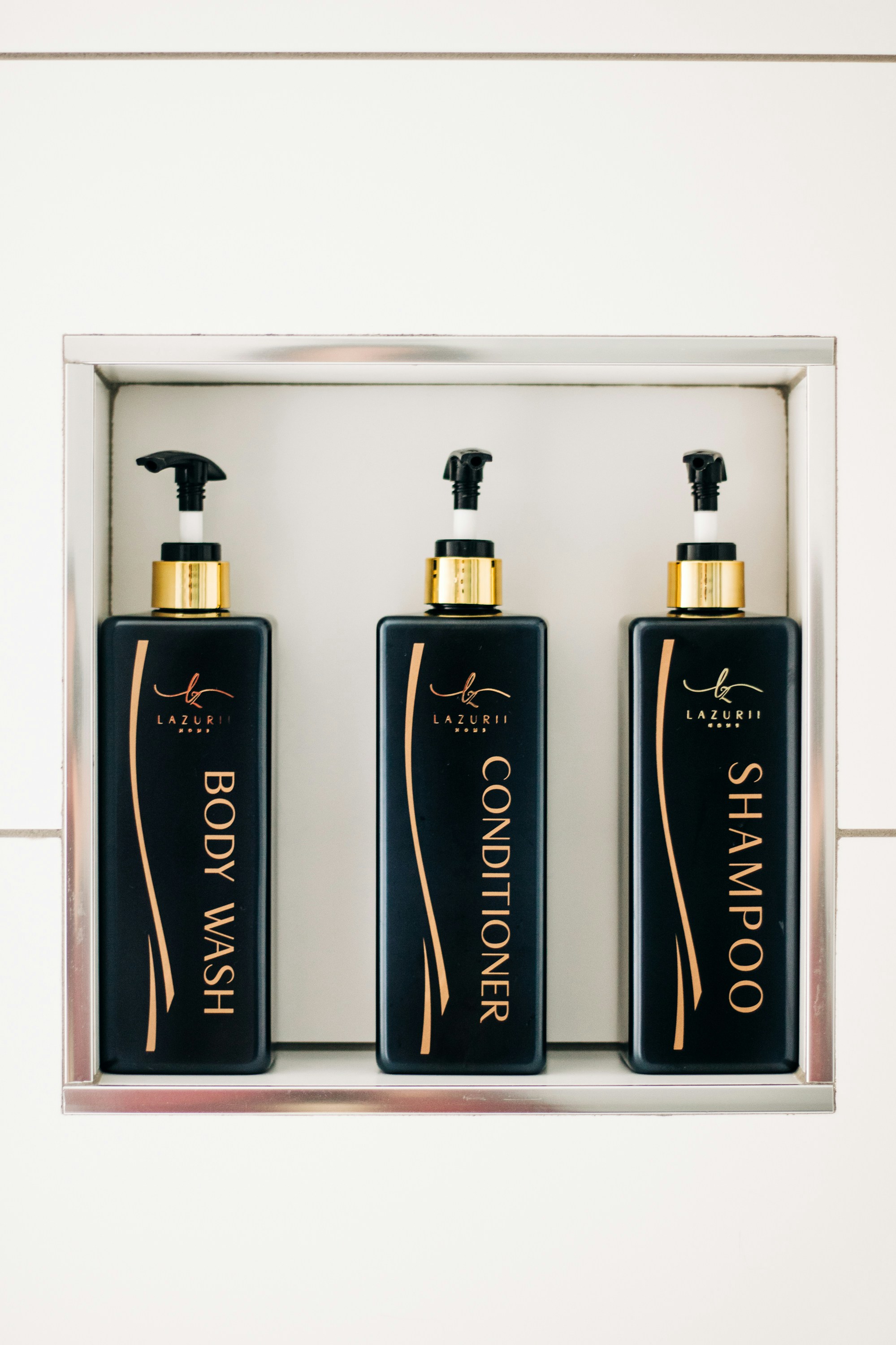 Three bottles of shampoo and lotion in a box photo – Free Quincy Image ...