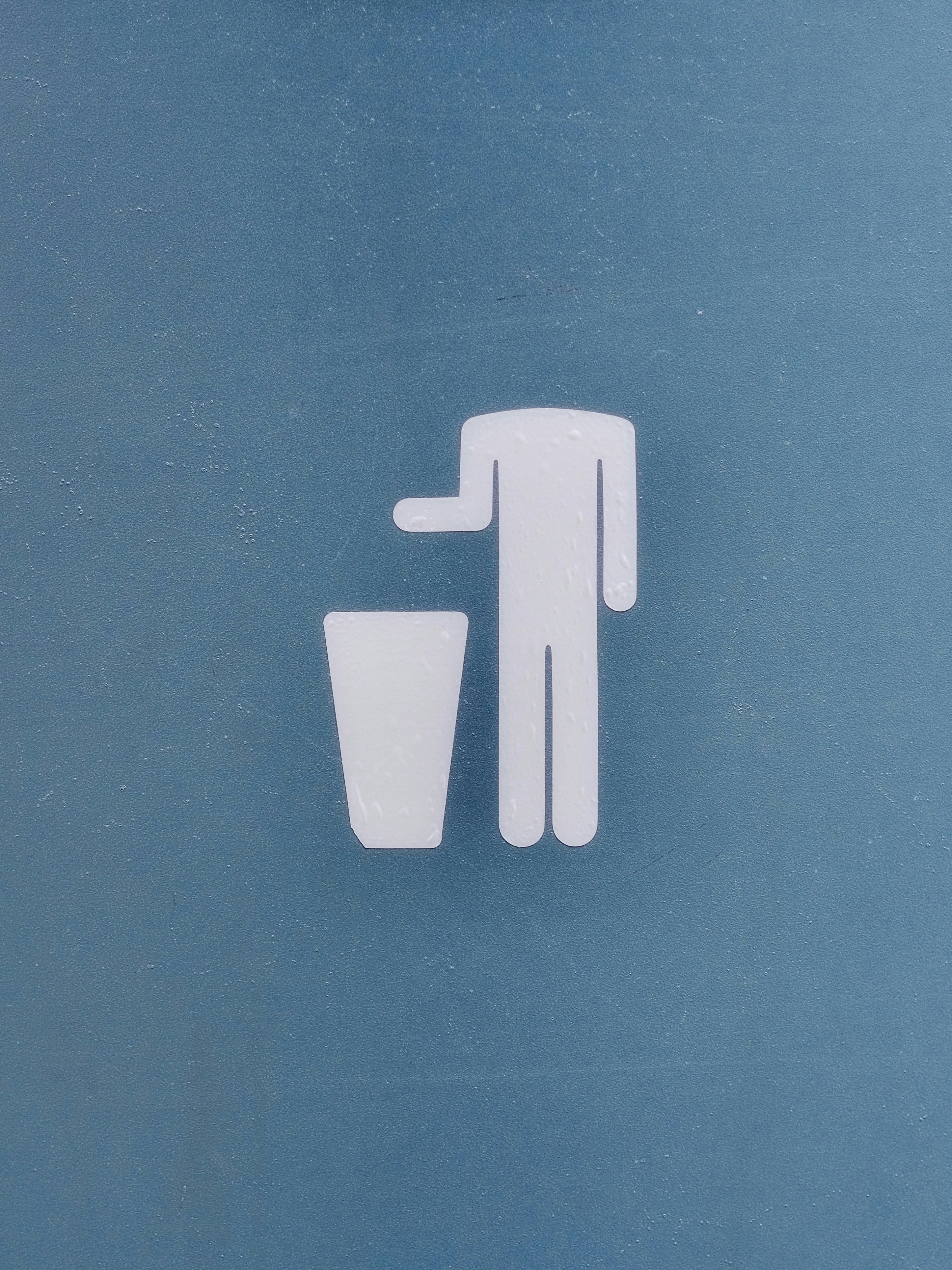 Minimalist human figure icon next to a trash bin on a textured blue background.