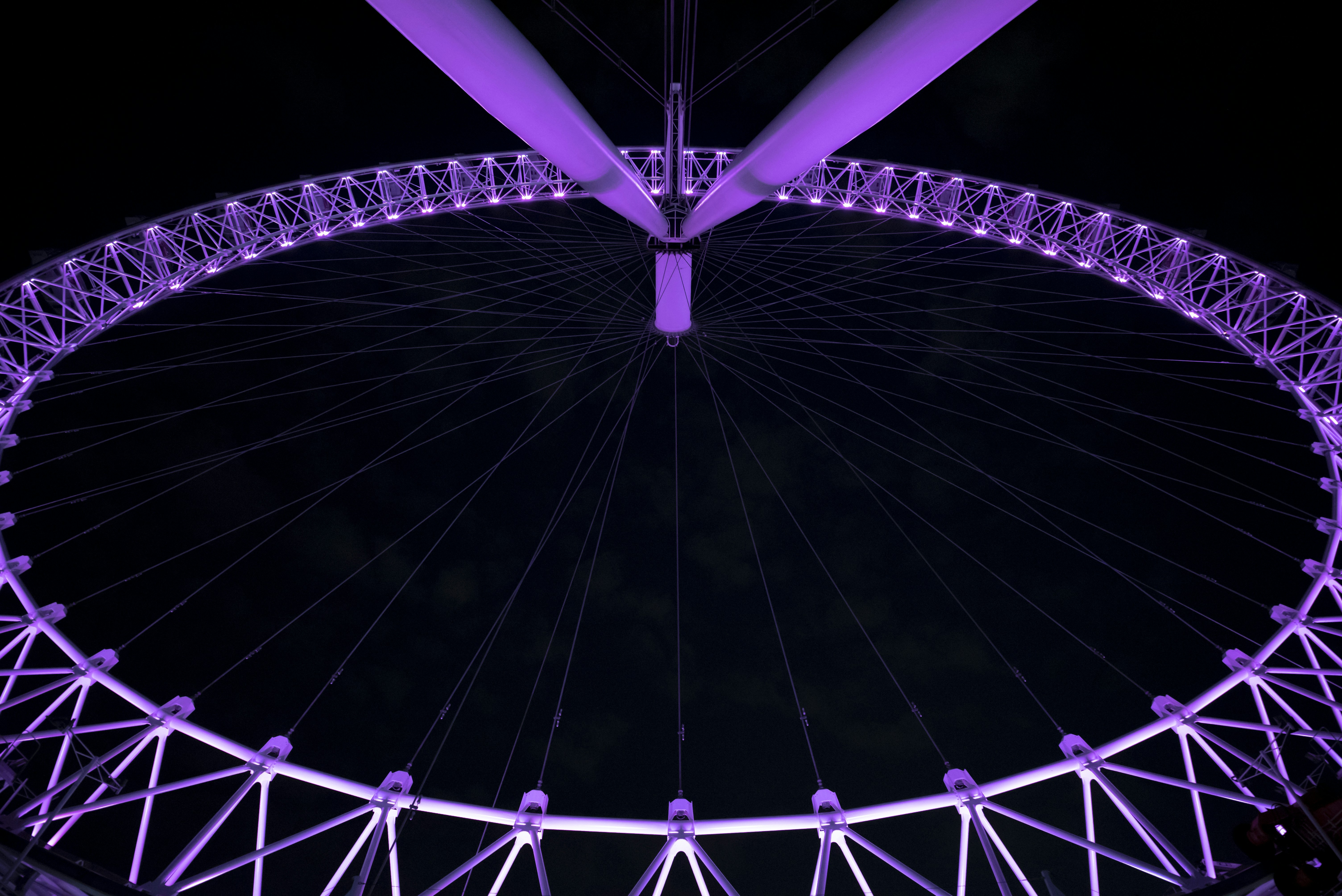 Purple Lattice at Night: The London Eye's Converging Spokes
